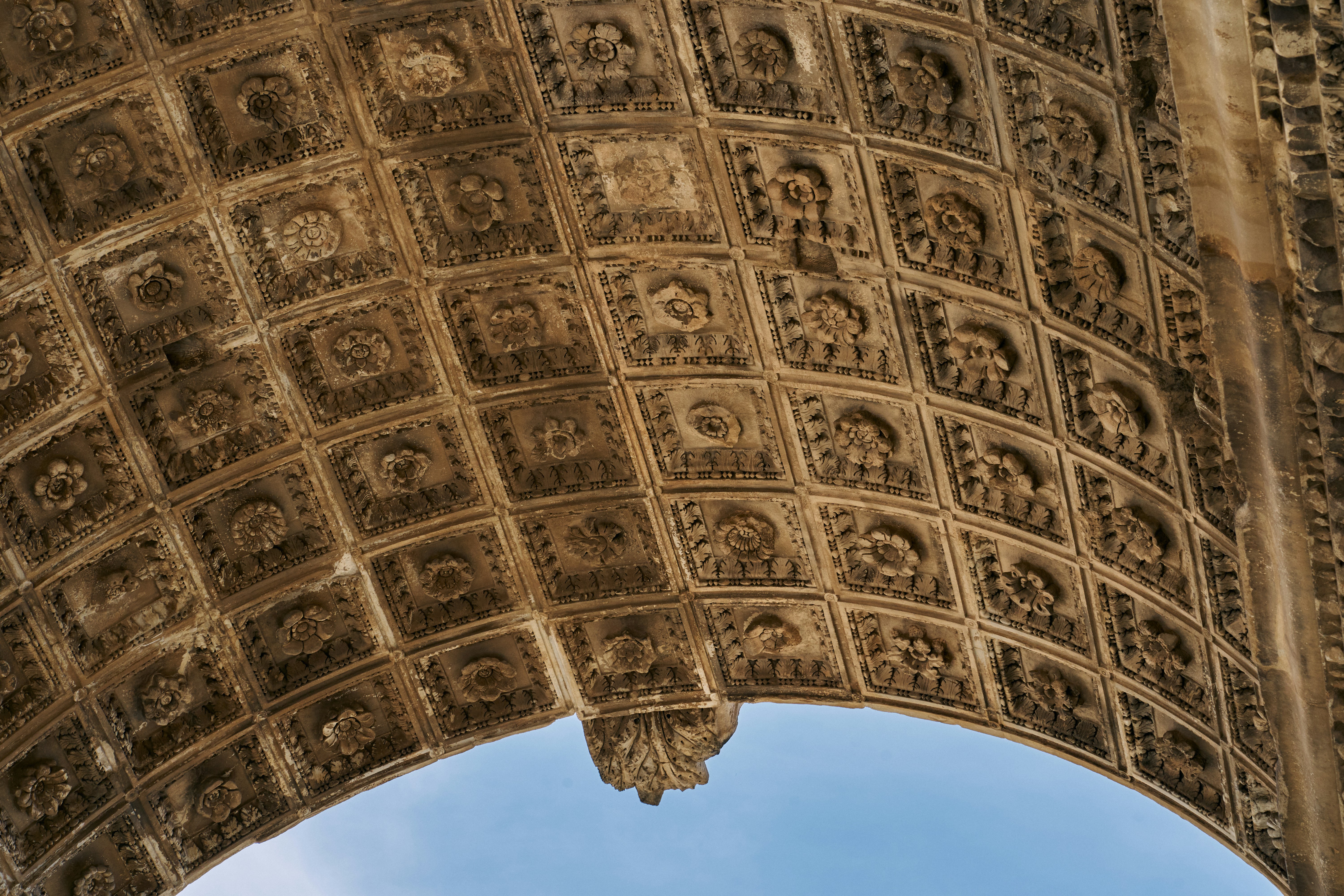 a ceiling with intricate carvings