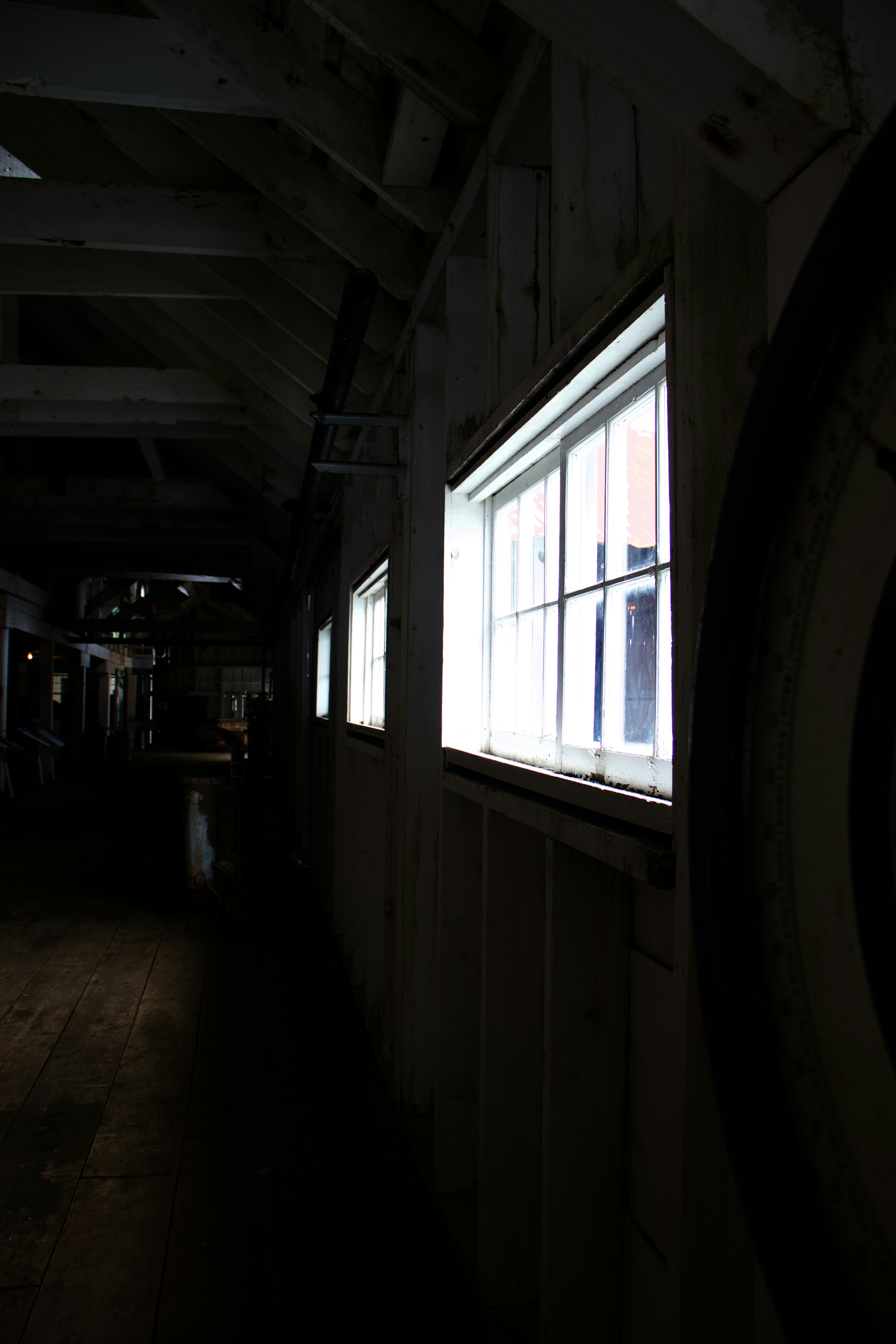 Timeworn Workshop: A Narrow Window Breathing Light Across Planked Floors