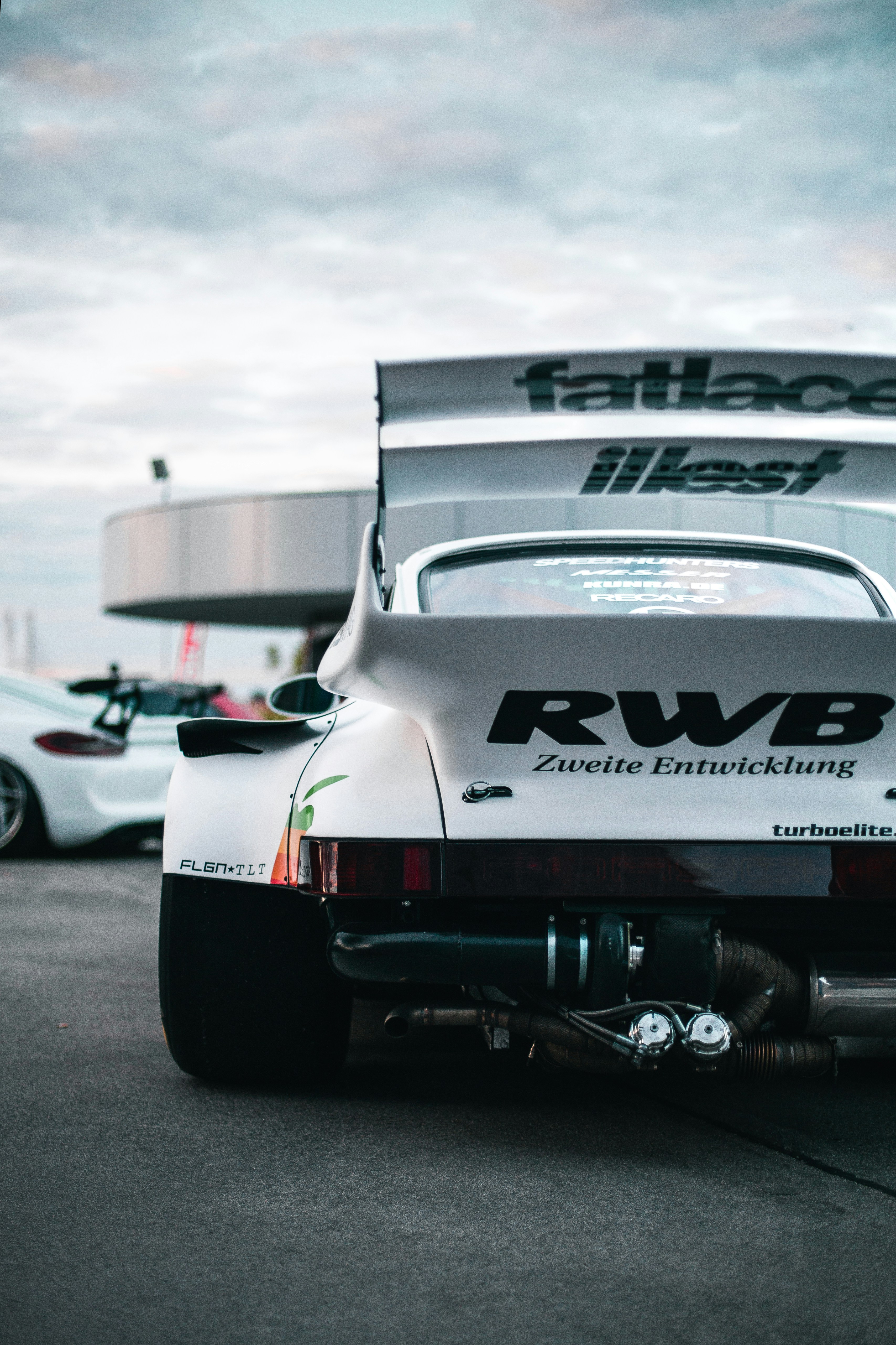 A white car with a large spoiler photo – Free Poland Image on Unsplash