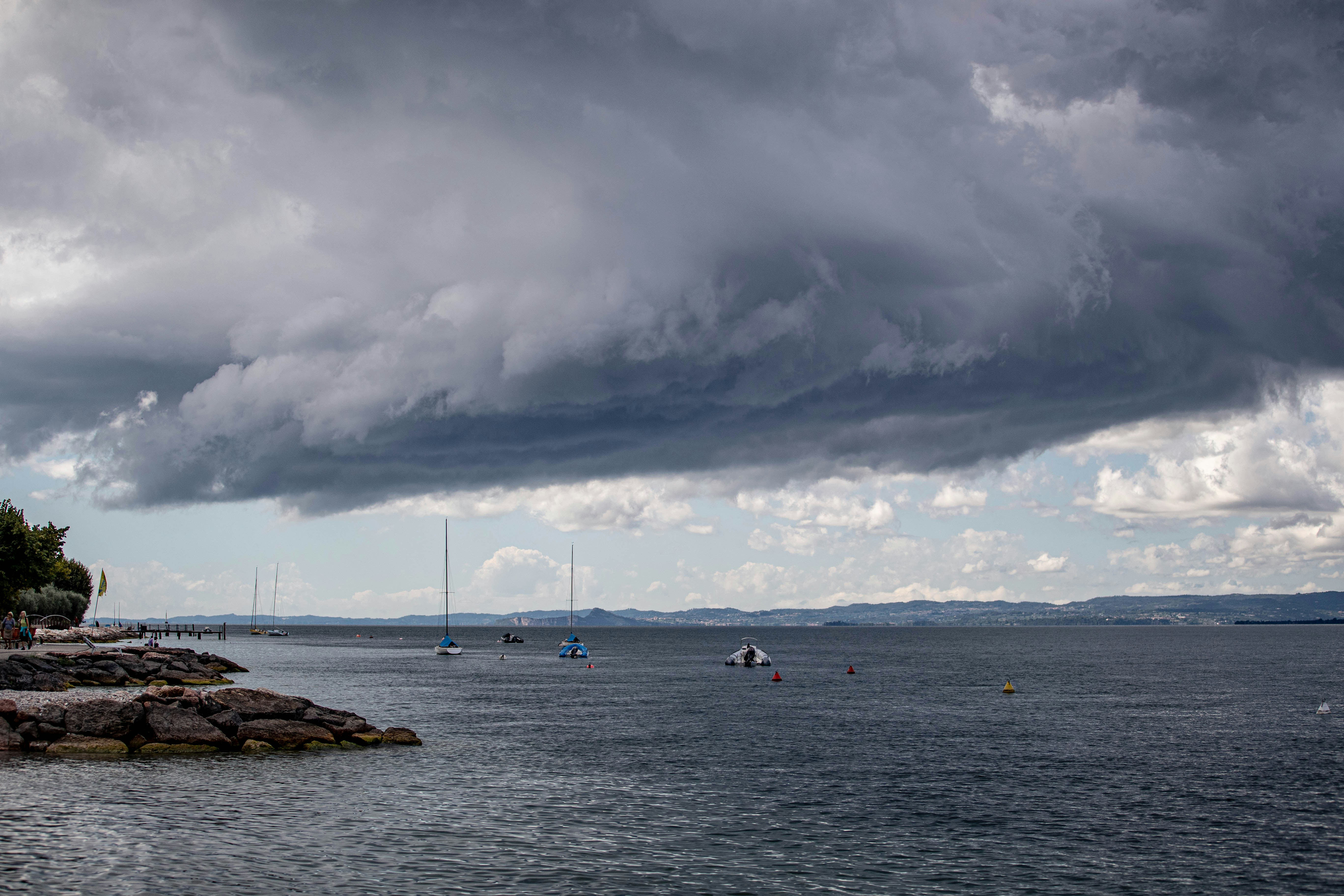 Storm-front Harbor: Sailboats Beneath a Looming Sky