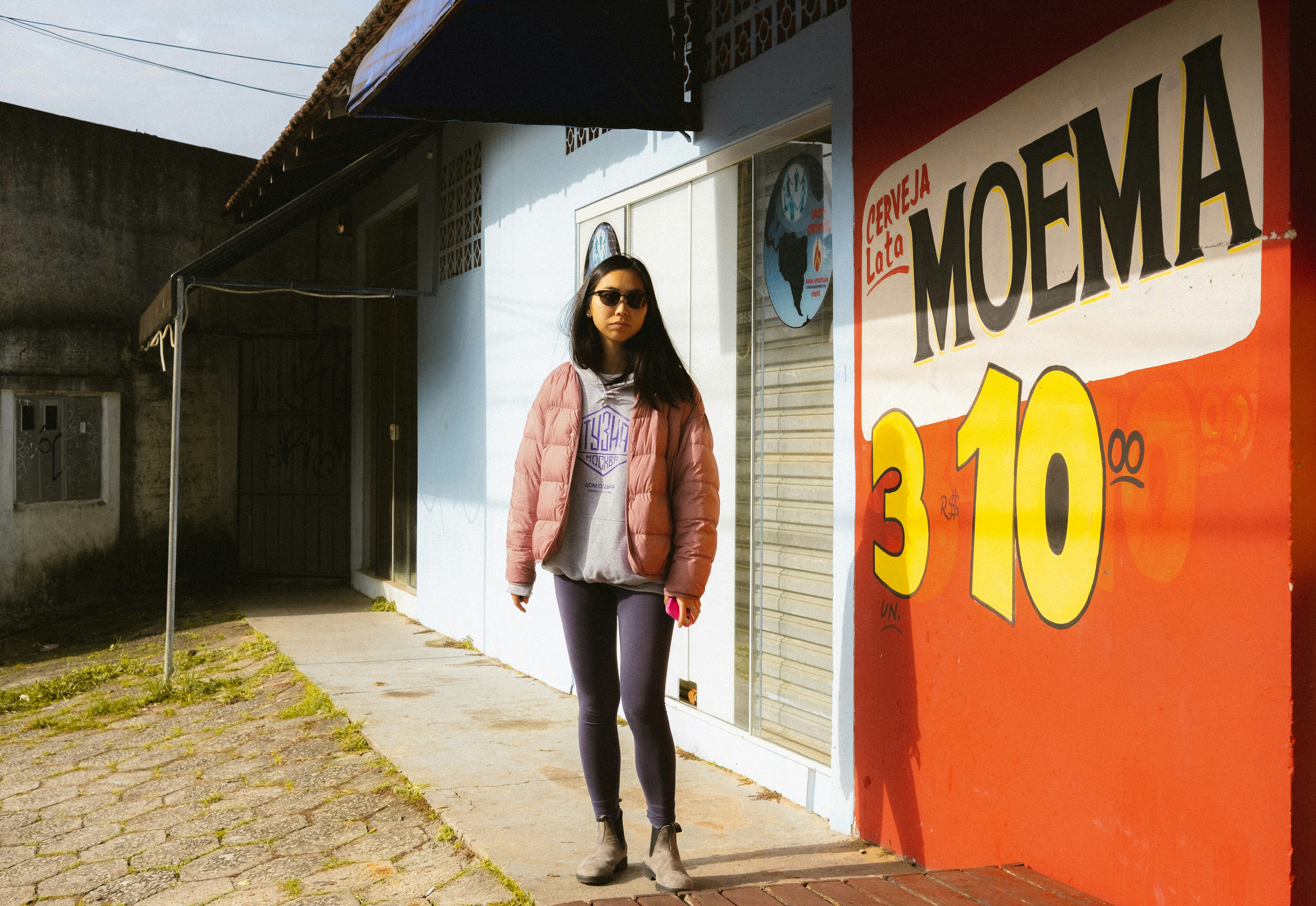 Sunlit Stroll by Moema's Bold Facade