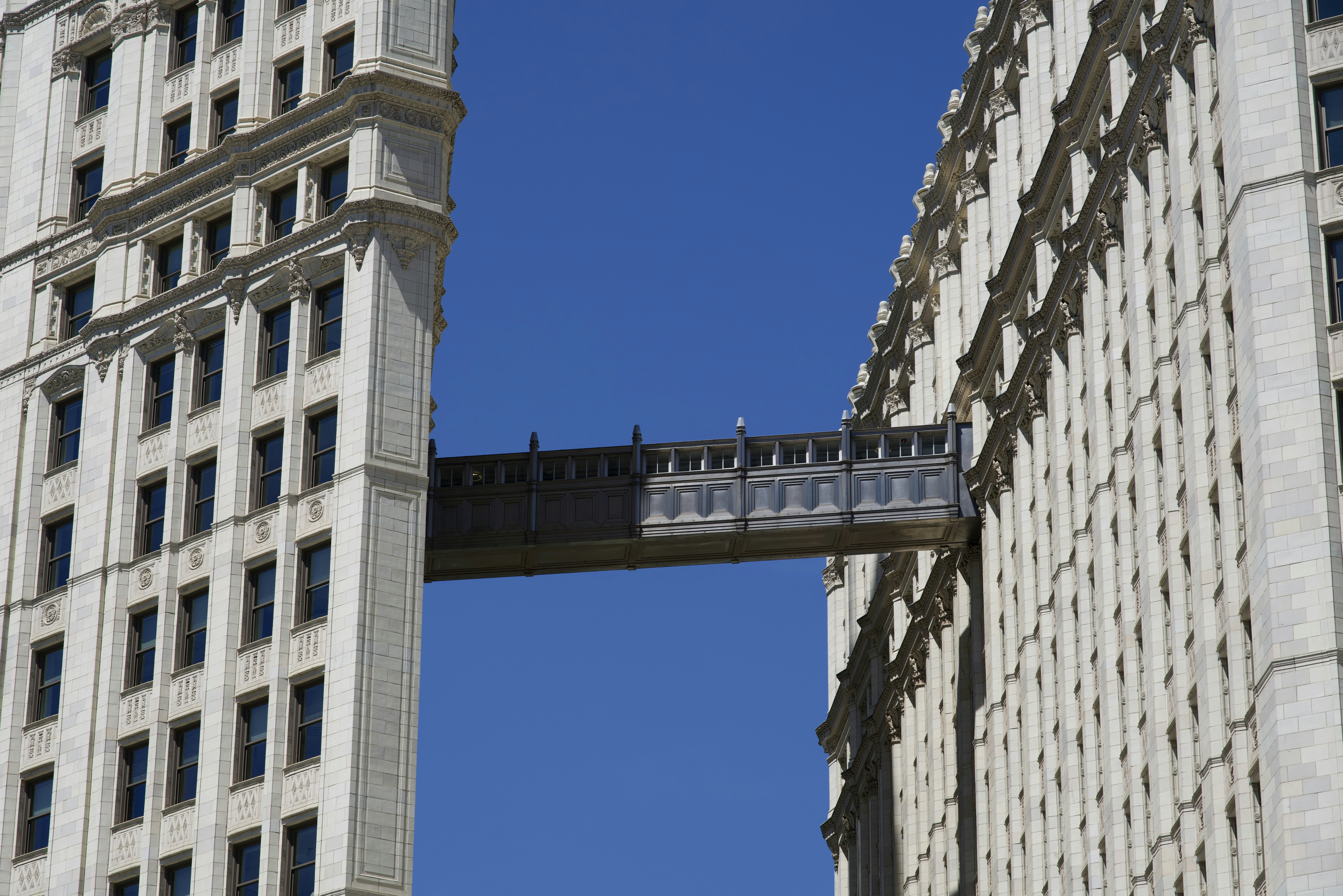 A bridge between two buildings photo – Free Blue Image on Unsplash