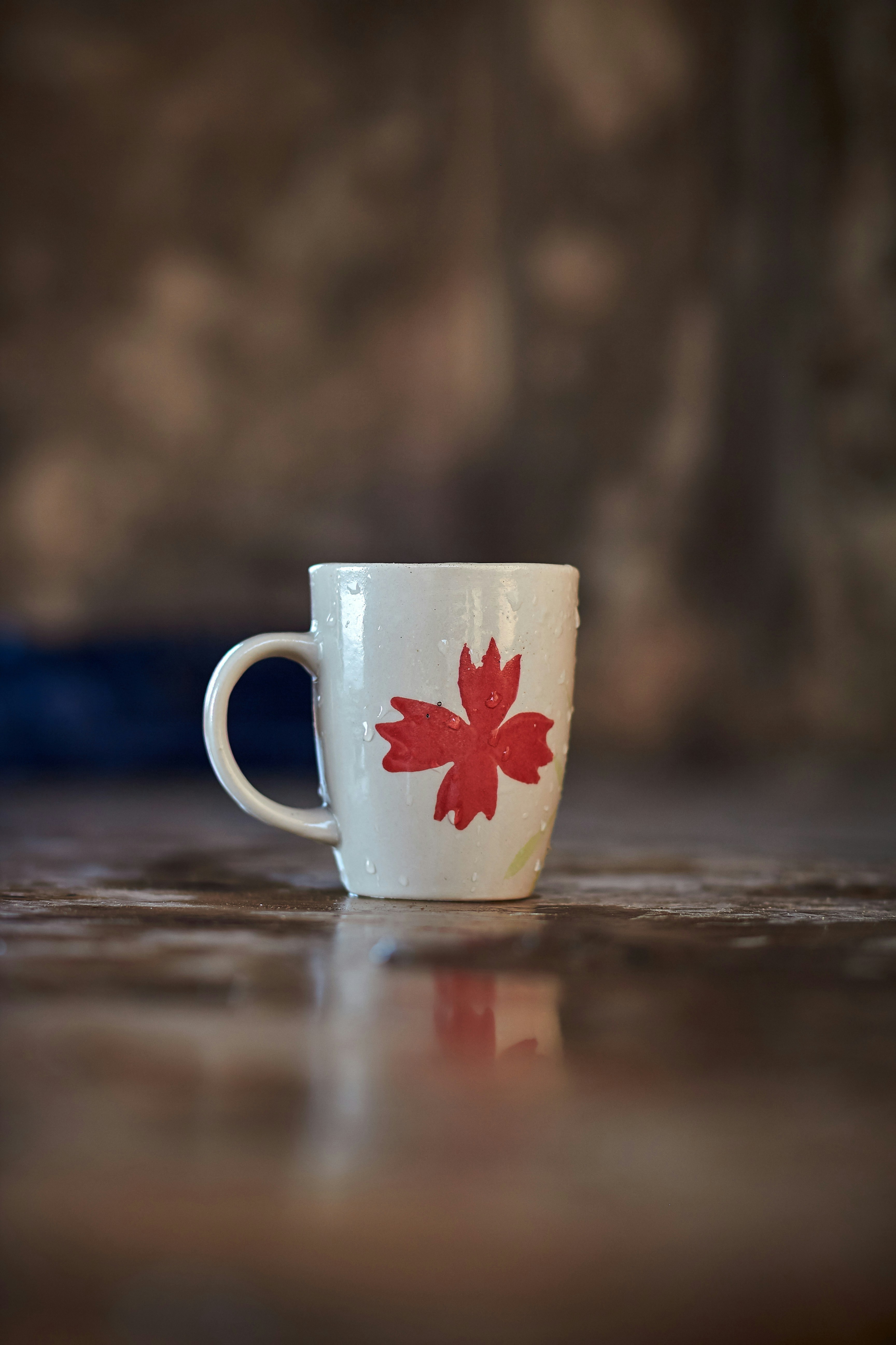 Lonely Red Maple on White Ceramic: A Quiet Coffee Moment