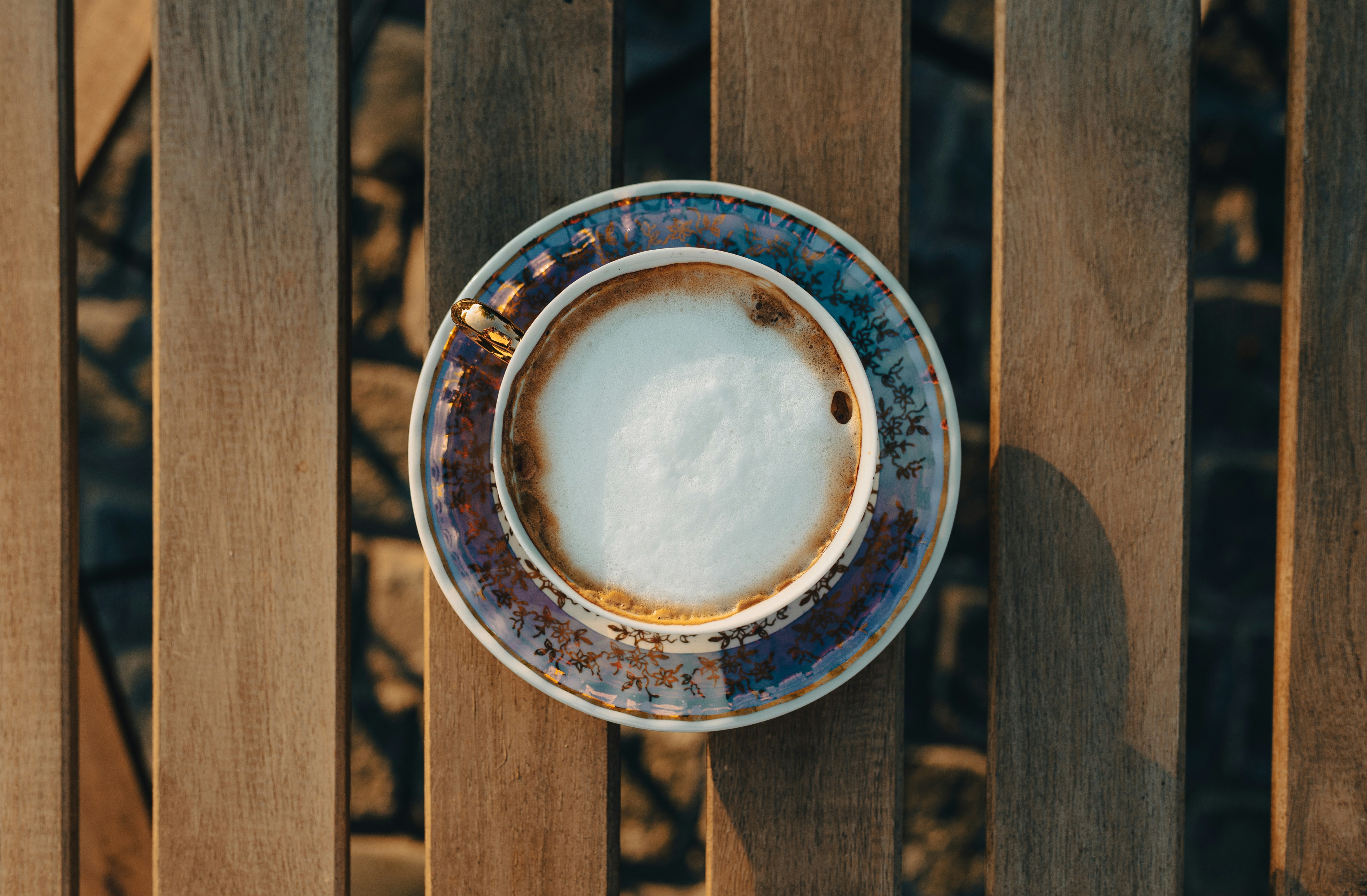 Blue Floral Saucer Morning: Coffee Centered on Weathered Slats