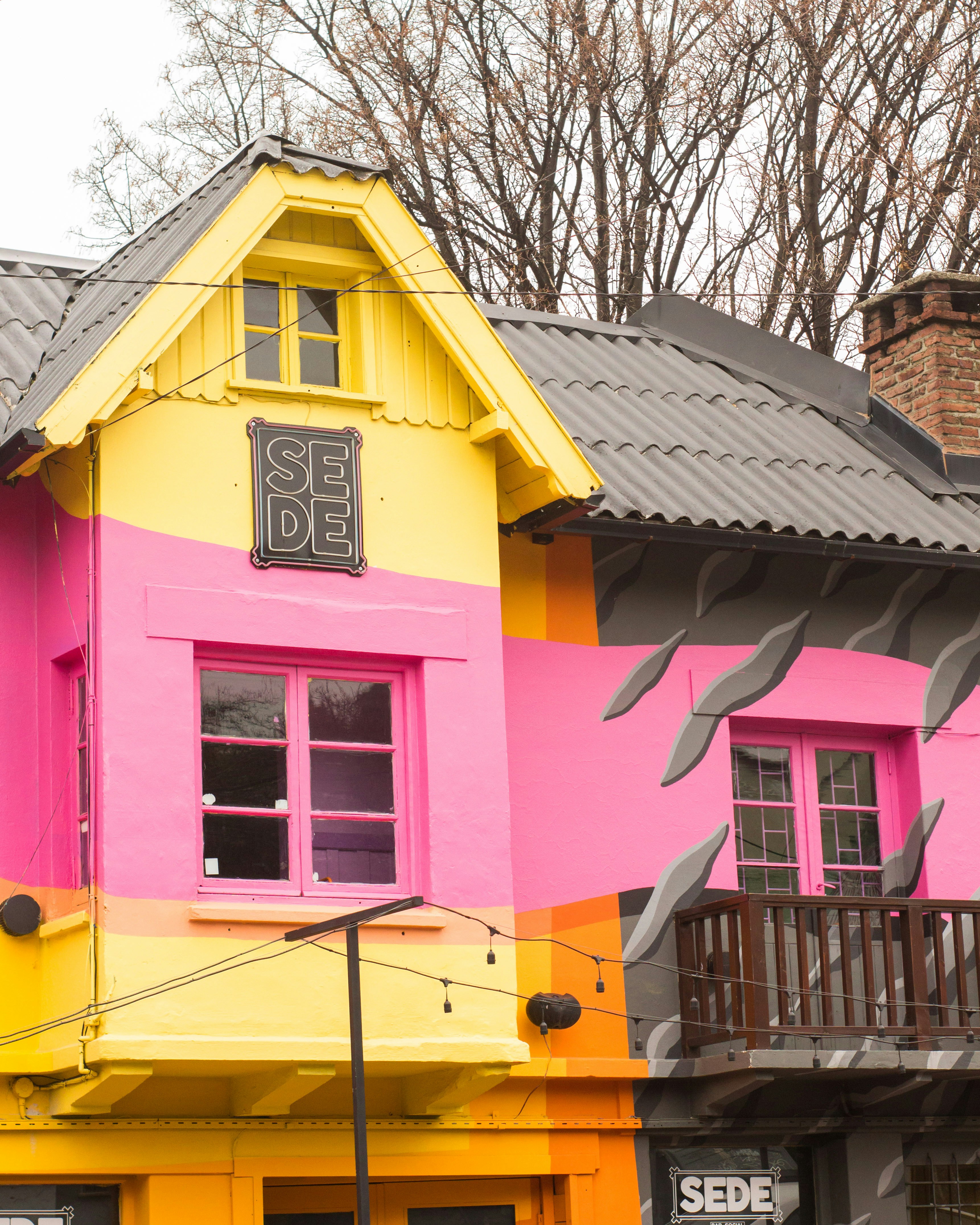 A yellow and red building photo – Free Streetart Image on Unsplash