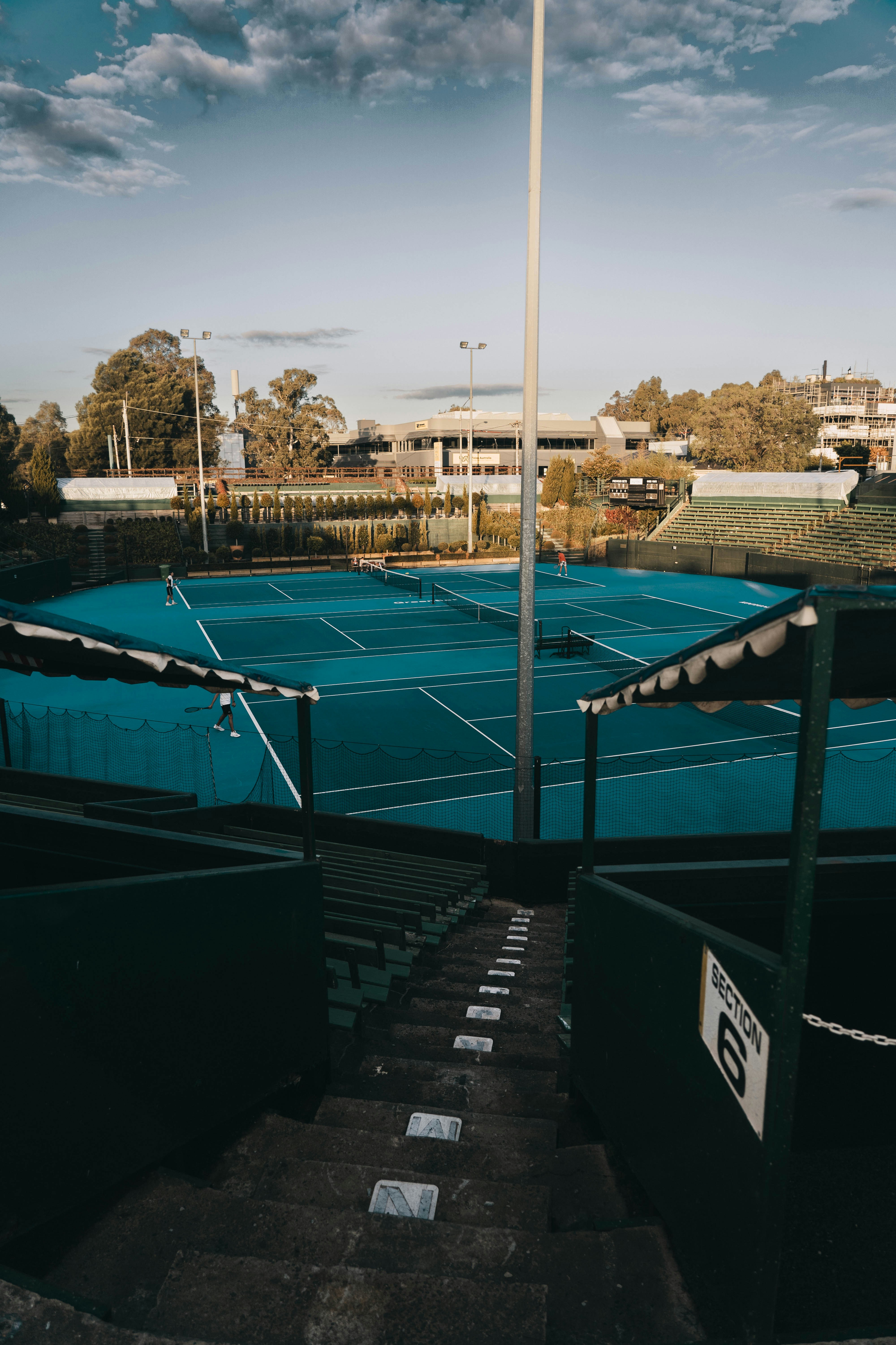 Staircase Approach to a Quiet Blue Tennis Arena