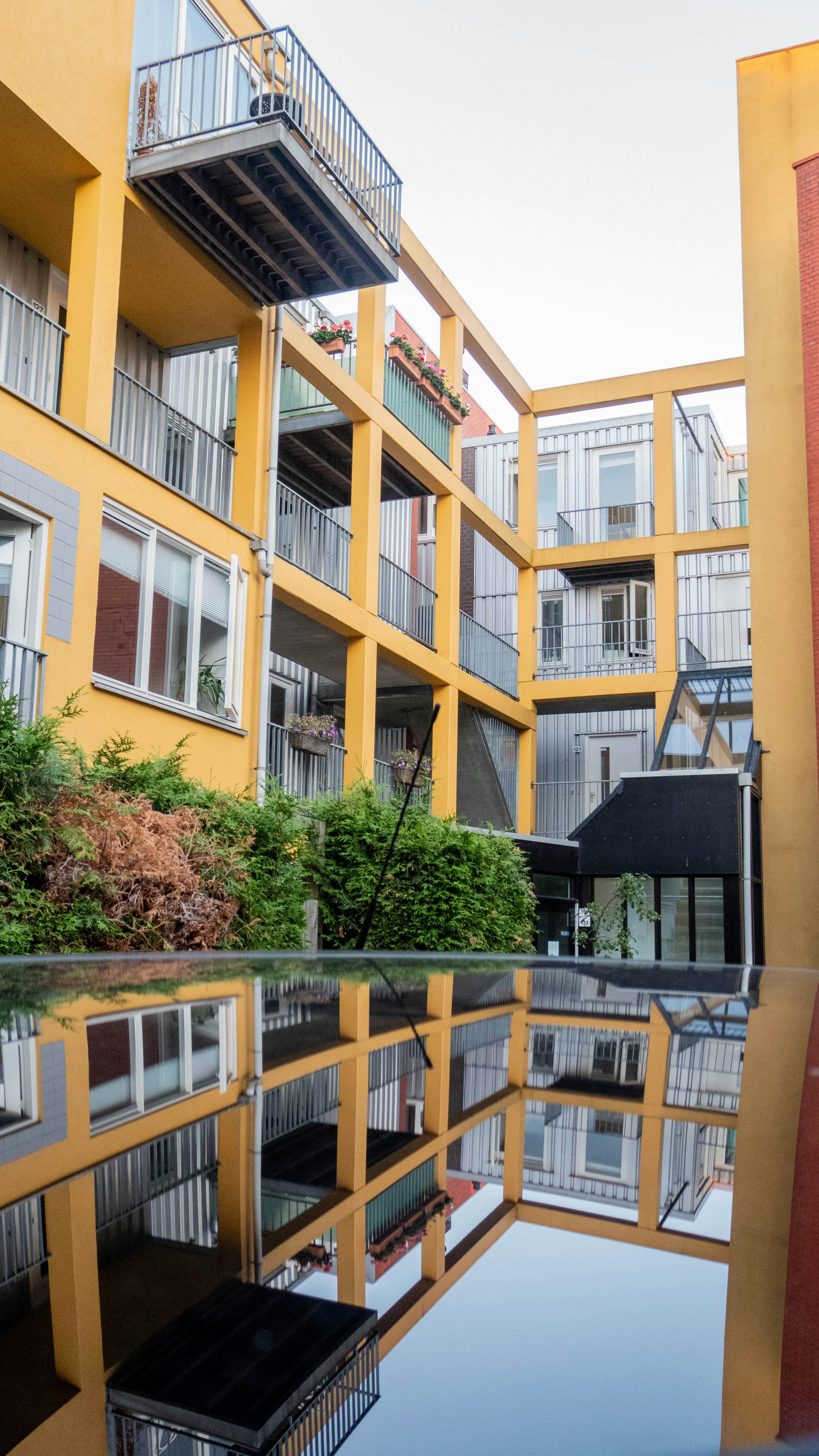 Amber Grid: A Sunlit Courtyard Framed by Dancing Balconies
