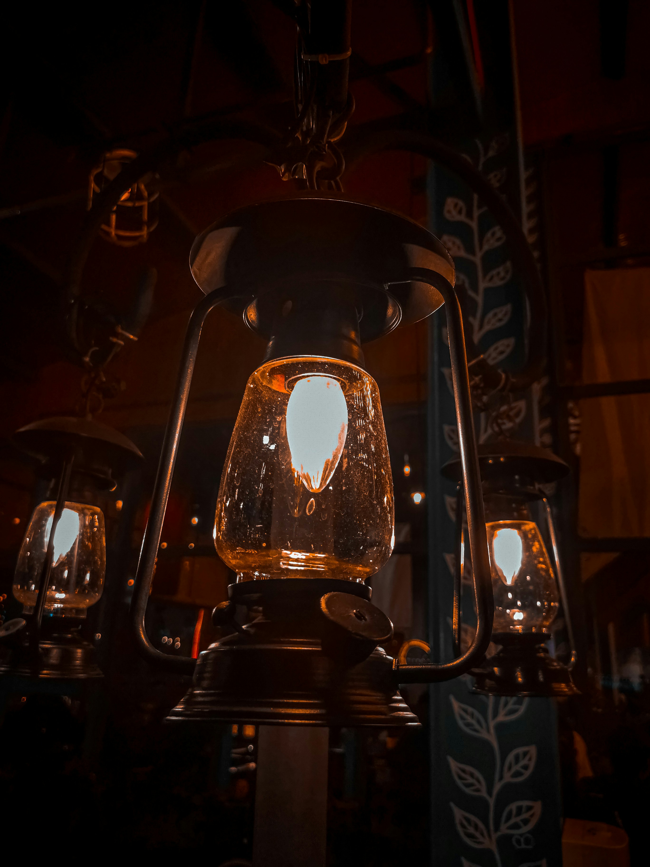 Amber Glow: A Close-Up of a Vintage Lantern in Dim Indoor Lighting