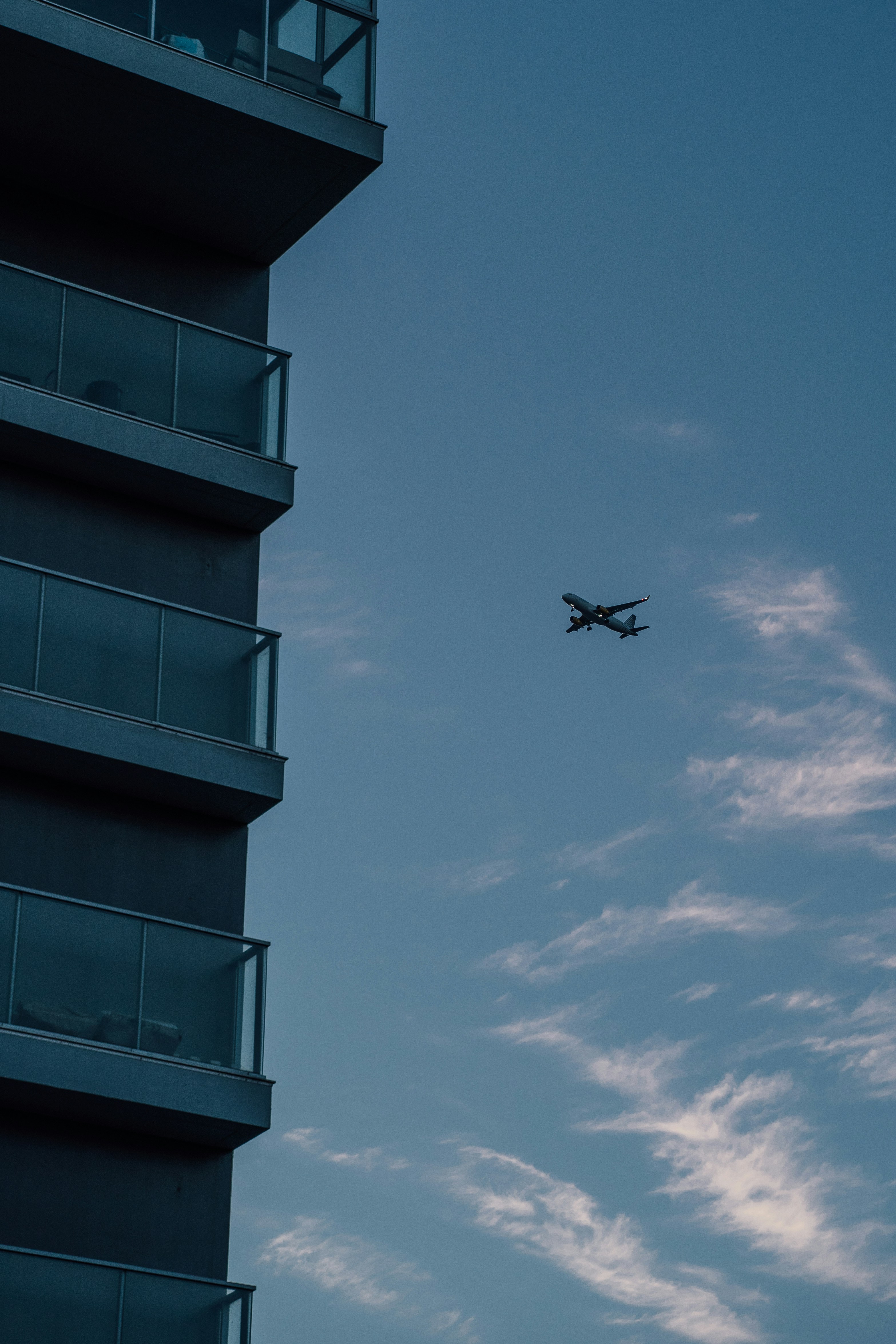 Urban Monolith and a Passing Jet