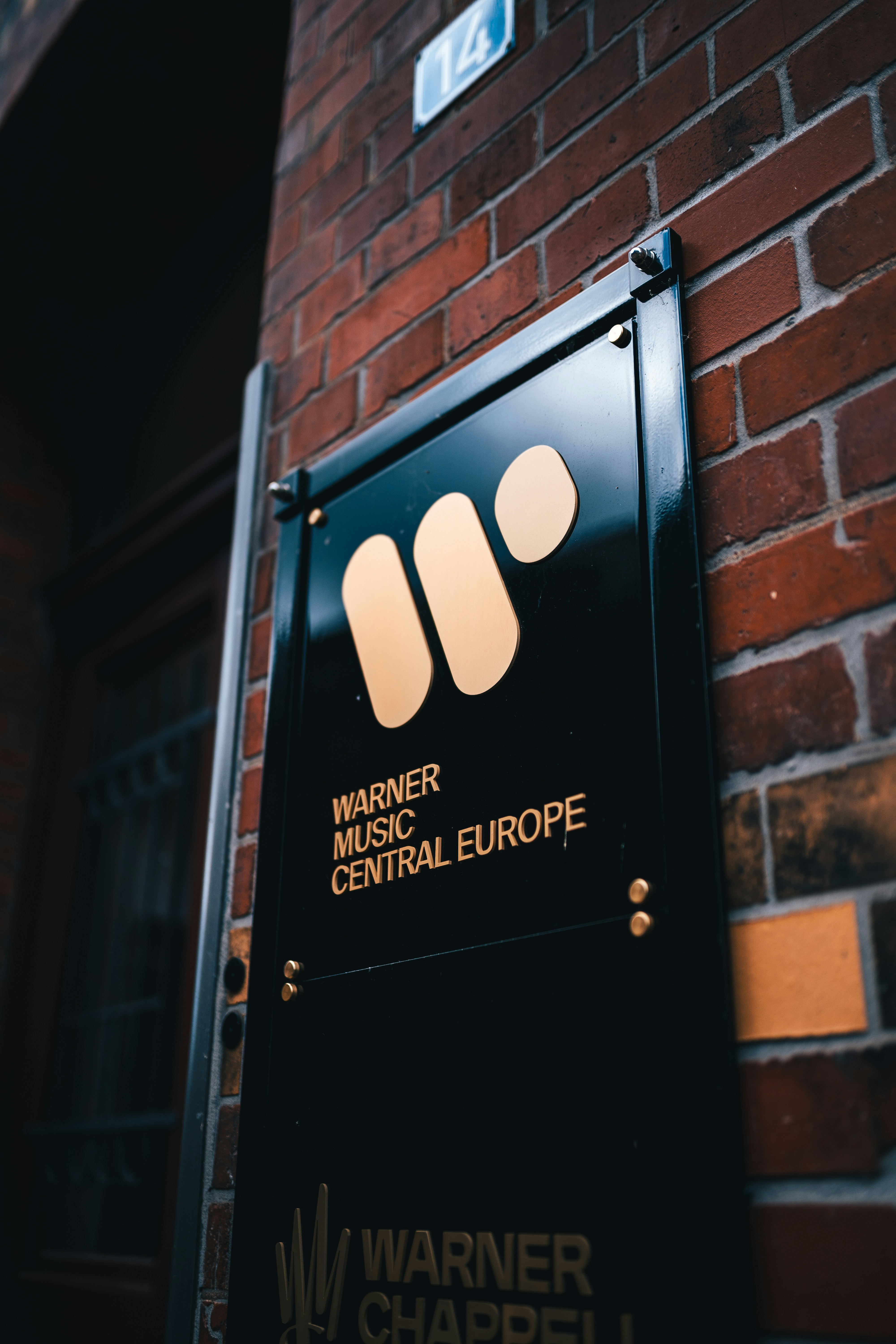 Emblem of Sound: Warner Music Central Europe on a Brick Backdrop