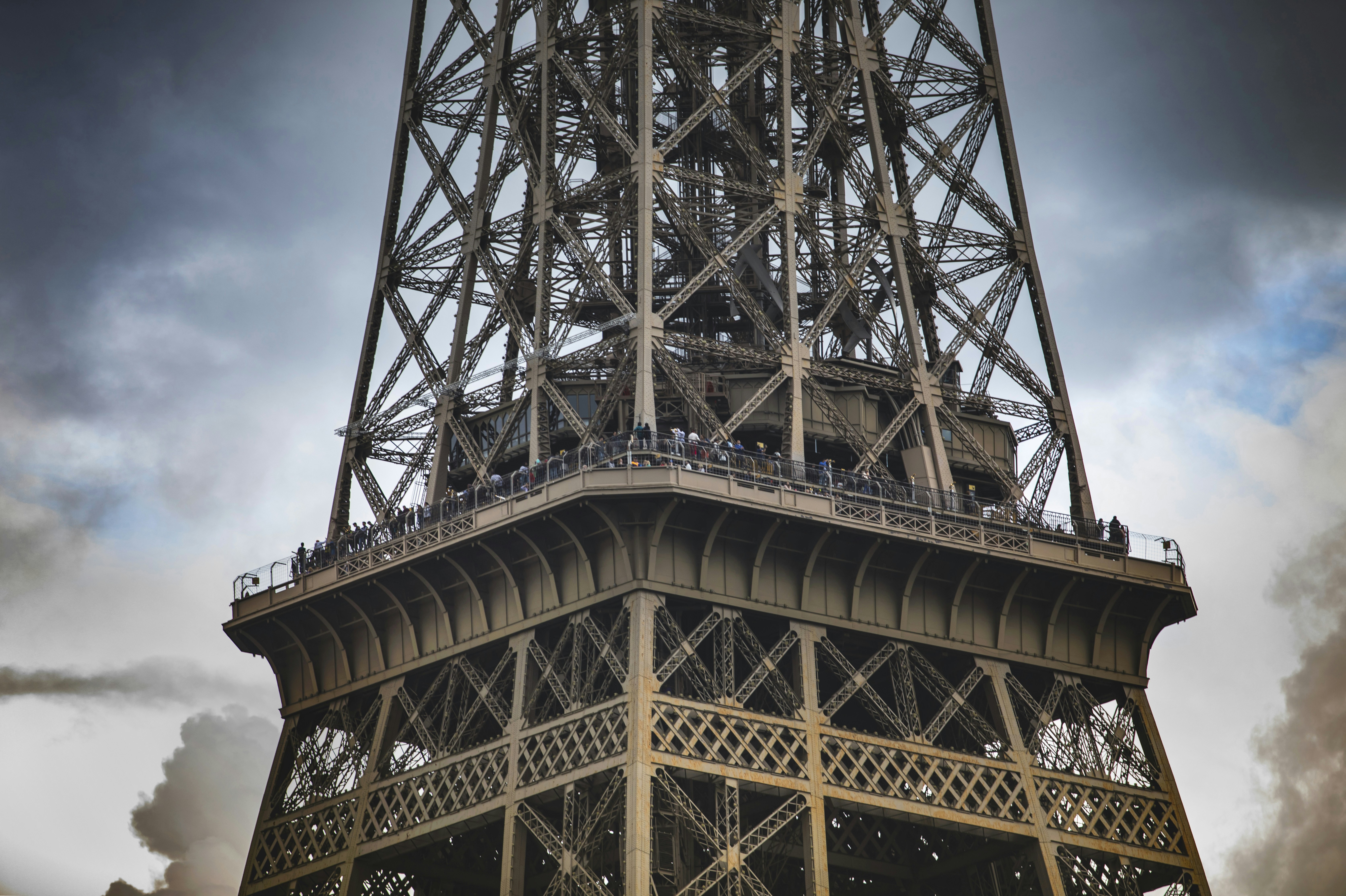 Iron Lacework and Crowds: A Close-Up on the Eiffel Tower's First Platform