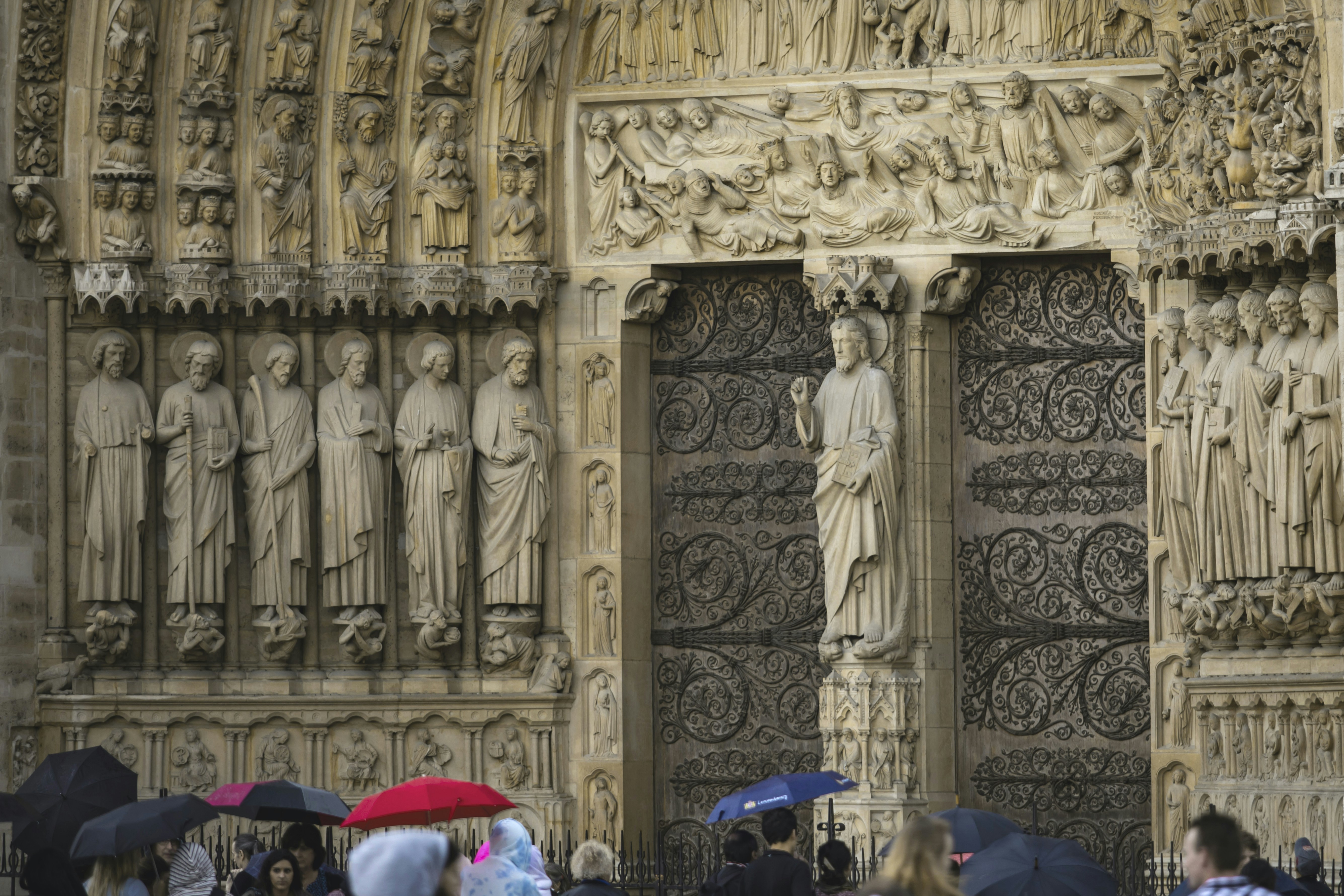 Gothic Portal Crowns: A Crowded Threshold Before Ornate Stonework