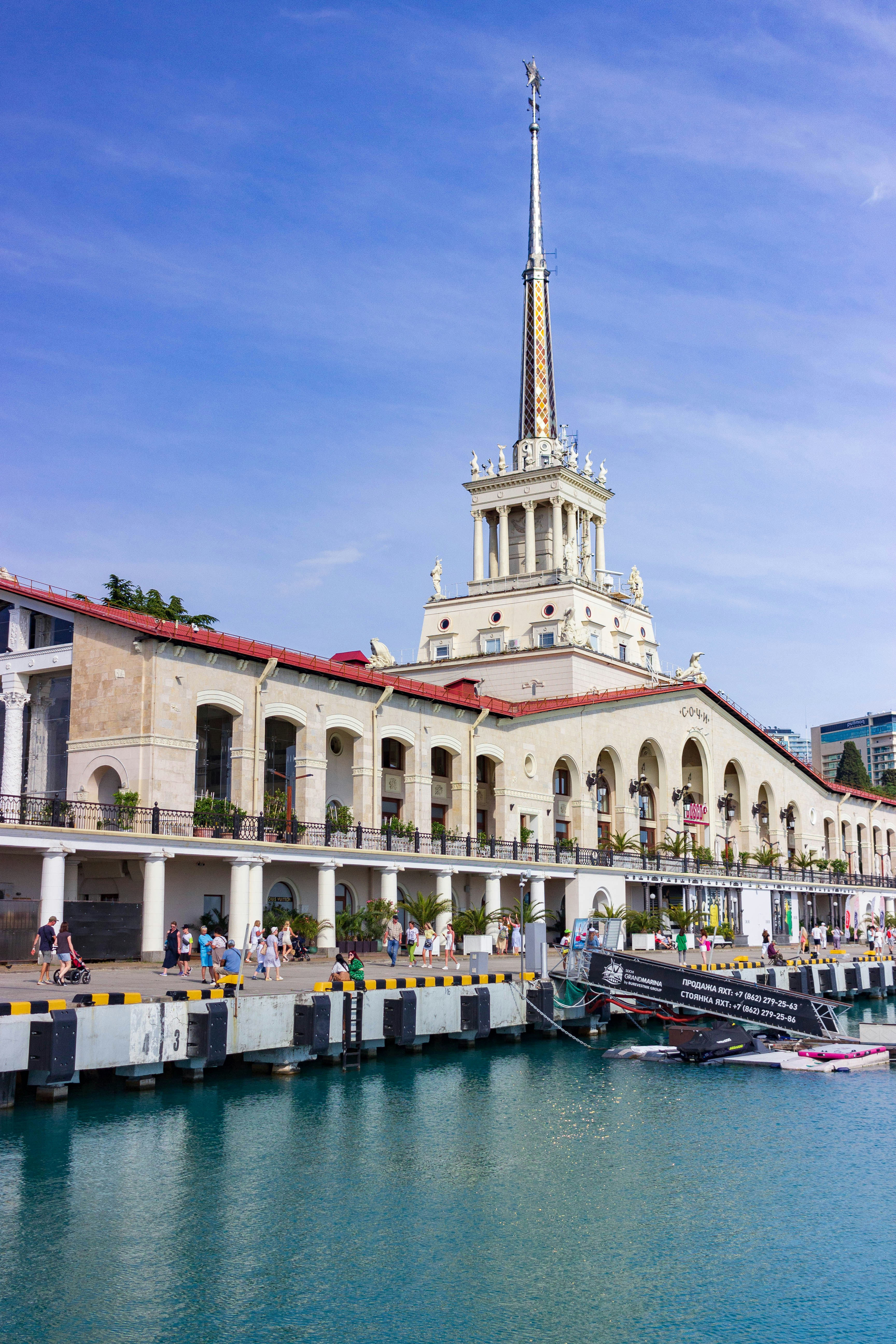 Harbor Spire Rising: A Neo-Classical Pier Framed by Turquoise Water
