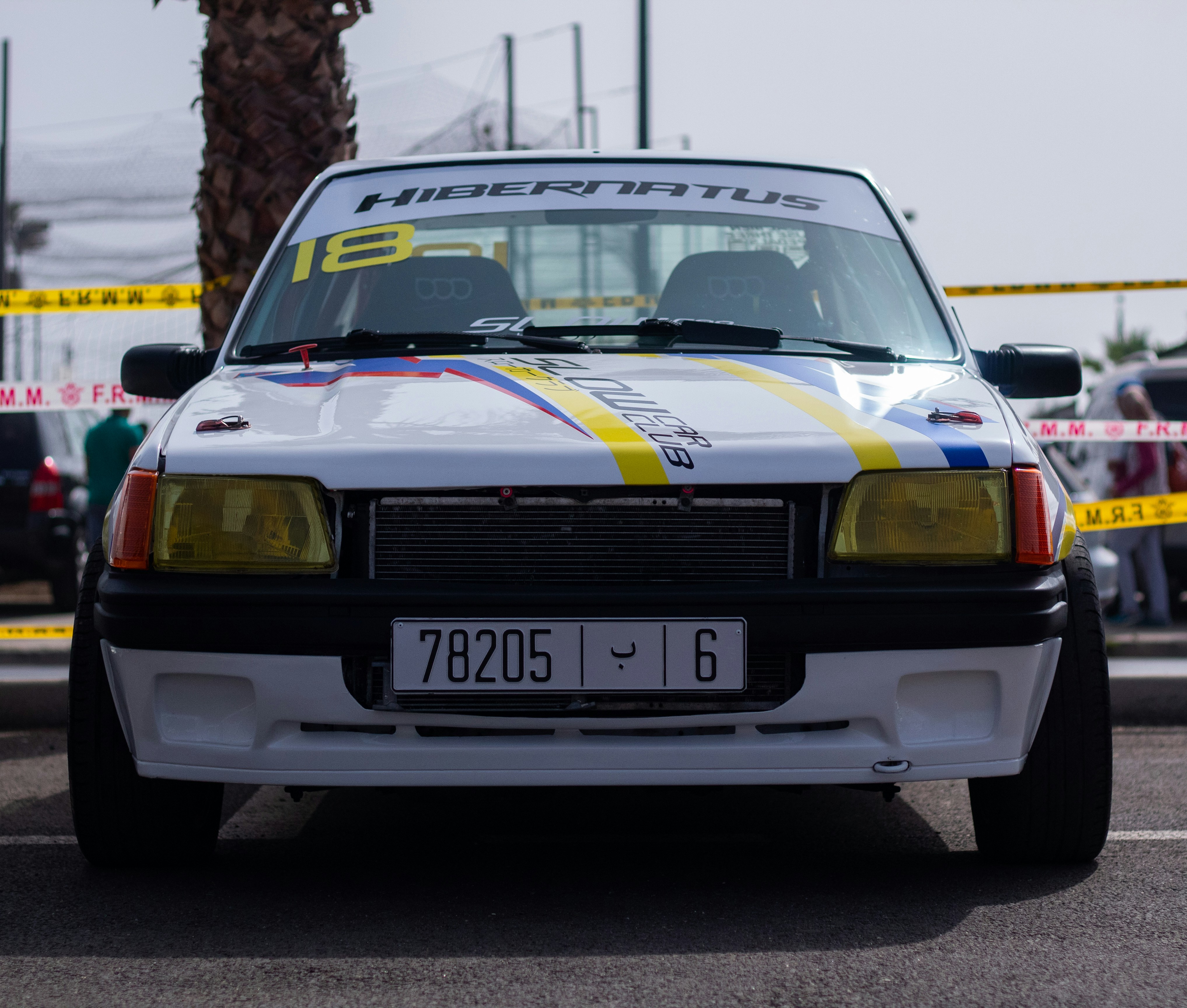 a white car with yellow stripes