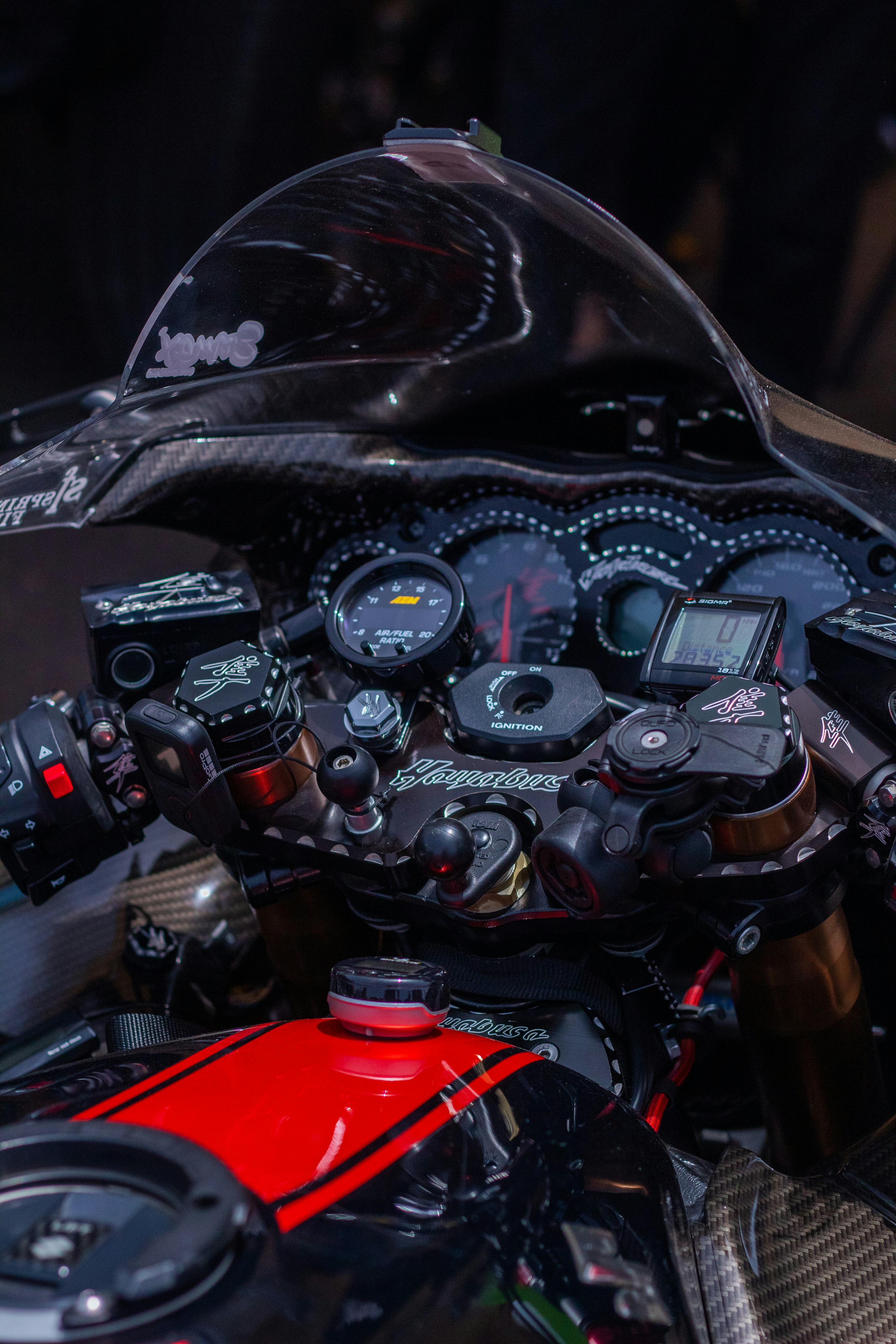 Night-Eye Cockpit: Neon Gleam on a Racing Motorcycle's Gauge Cluster