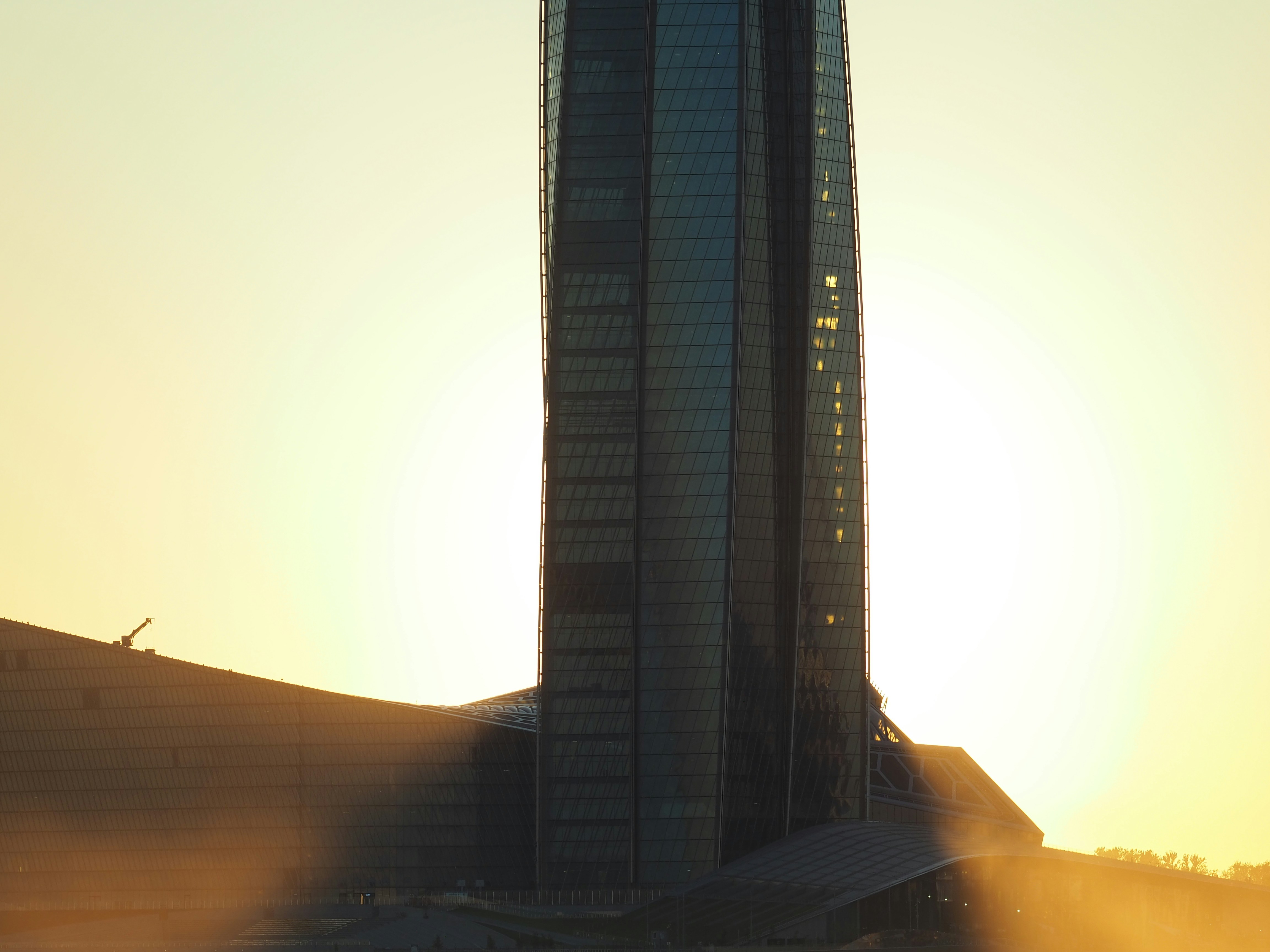 Glowing Monolith: Golden Hour Tower Embrace