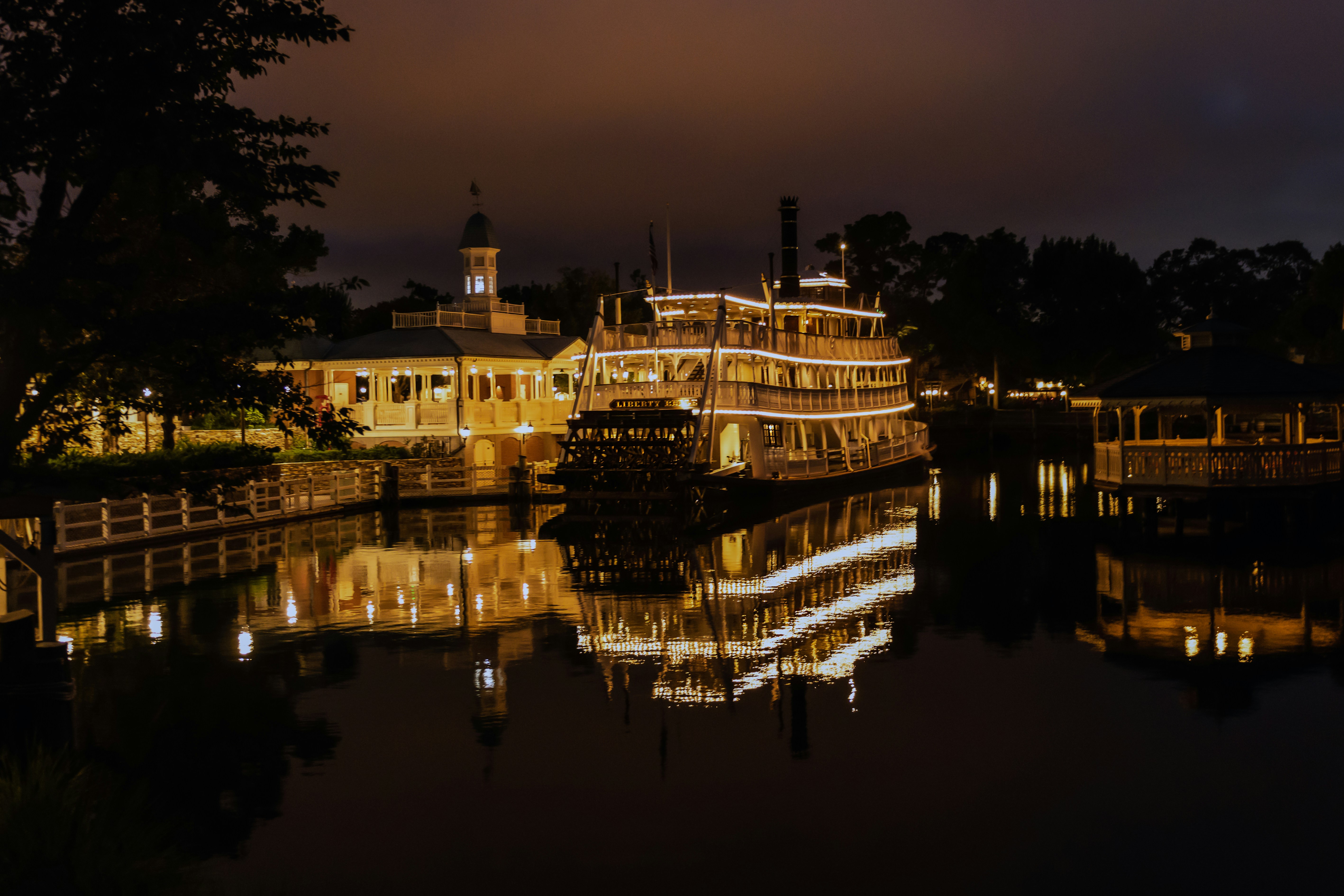 Lantern-Lit Reflections: The Idle Riverboat at Dusk