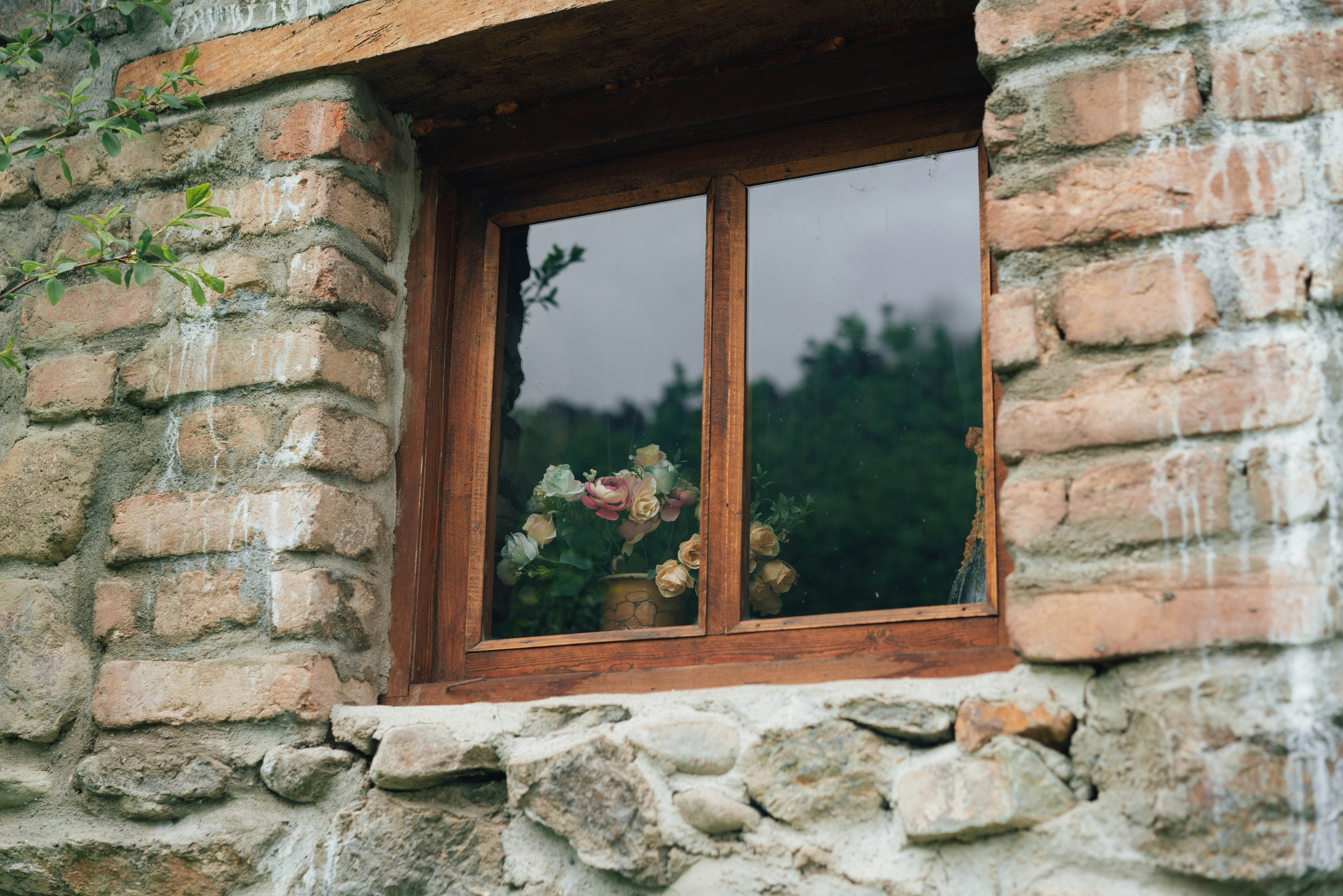 Stone-Walled Window with Blooms: A Quiet Indoor Vignette