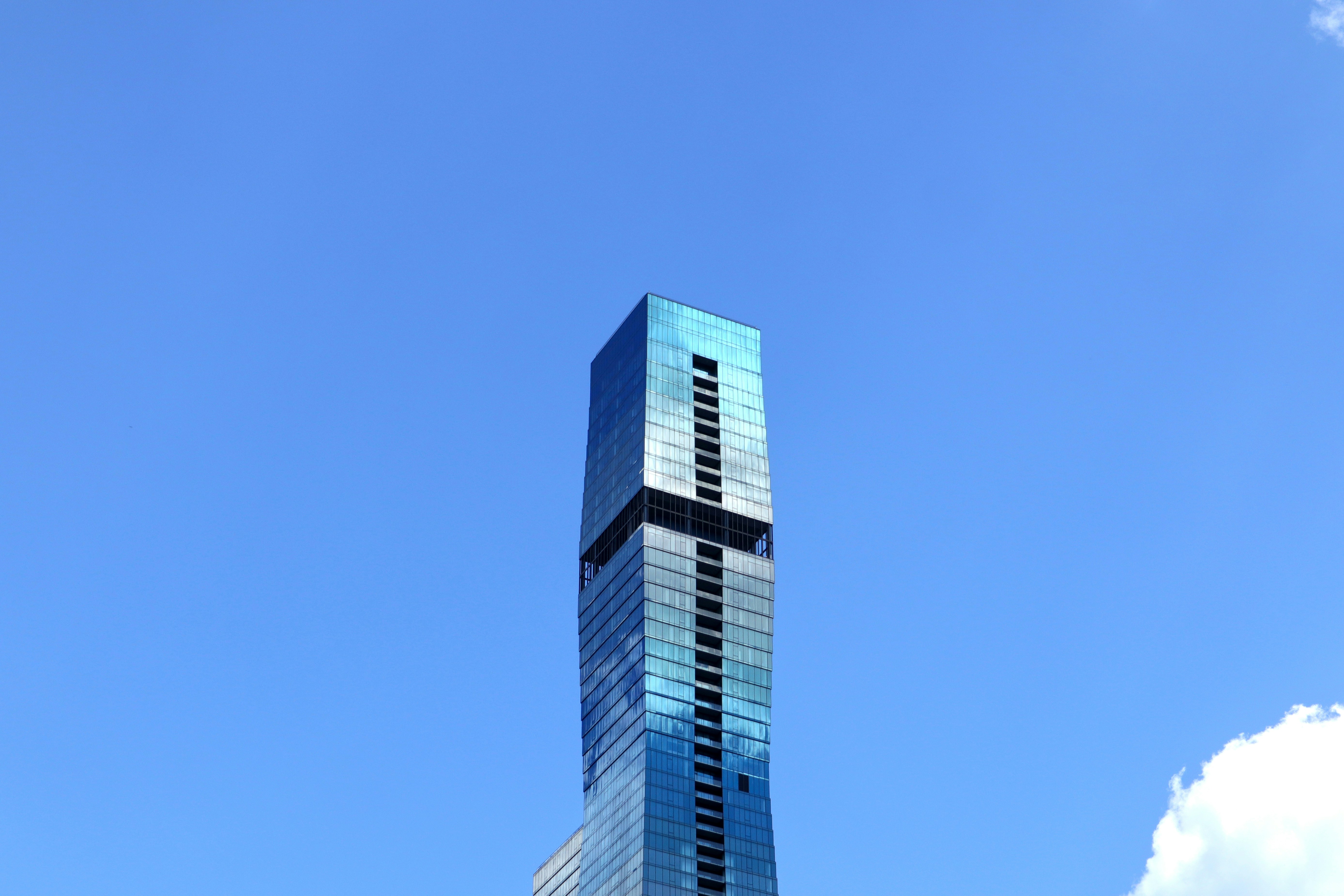 a tall building with a blue sky