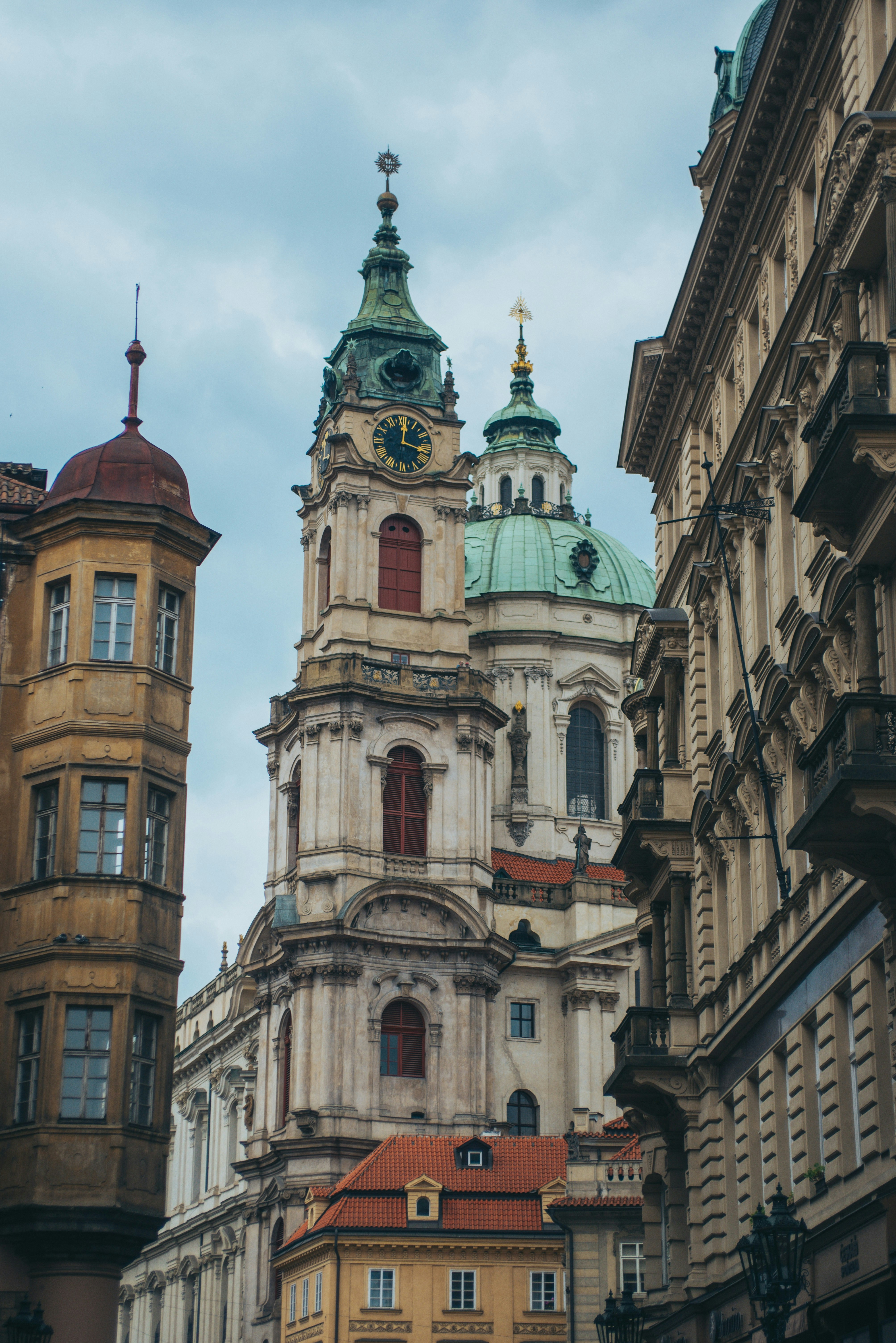 A clock tower in a city photo – Free Architecture Image on Unsplash