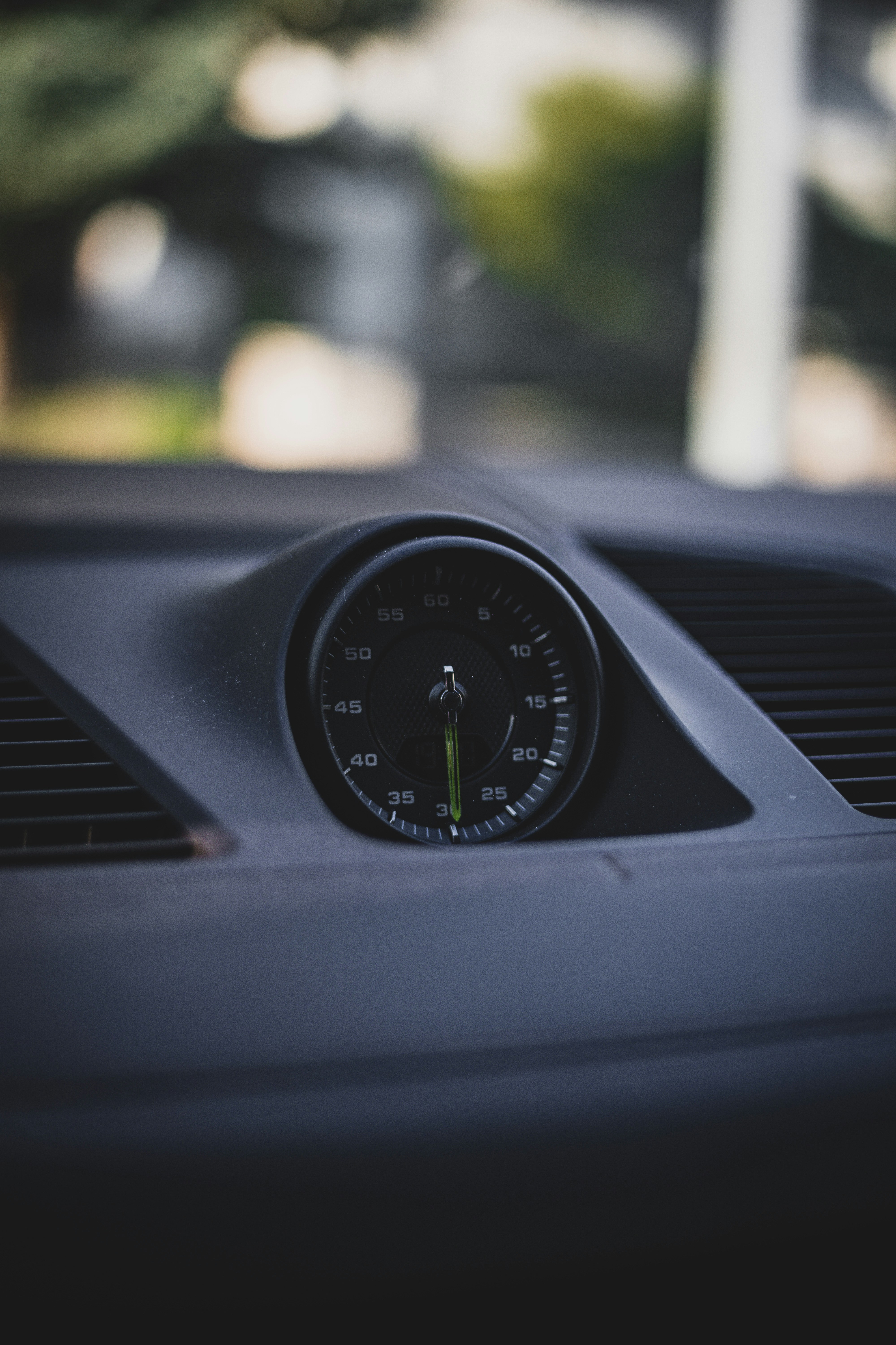 Dialed Time: Close-Up of a Car Dashboard Clock