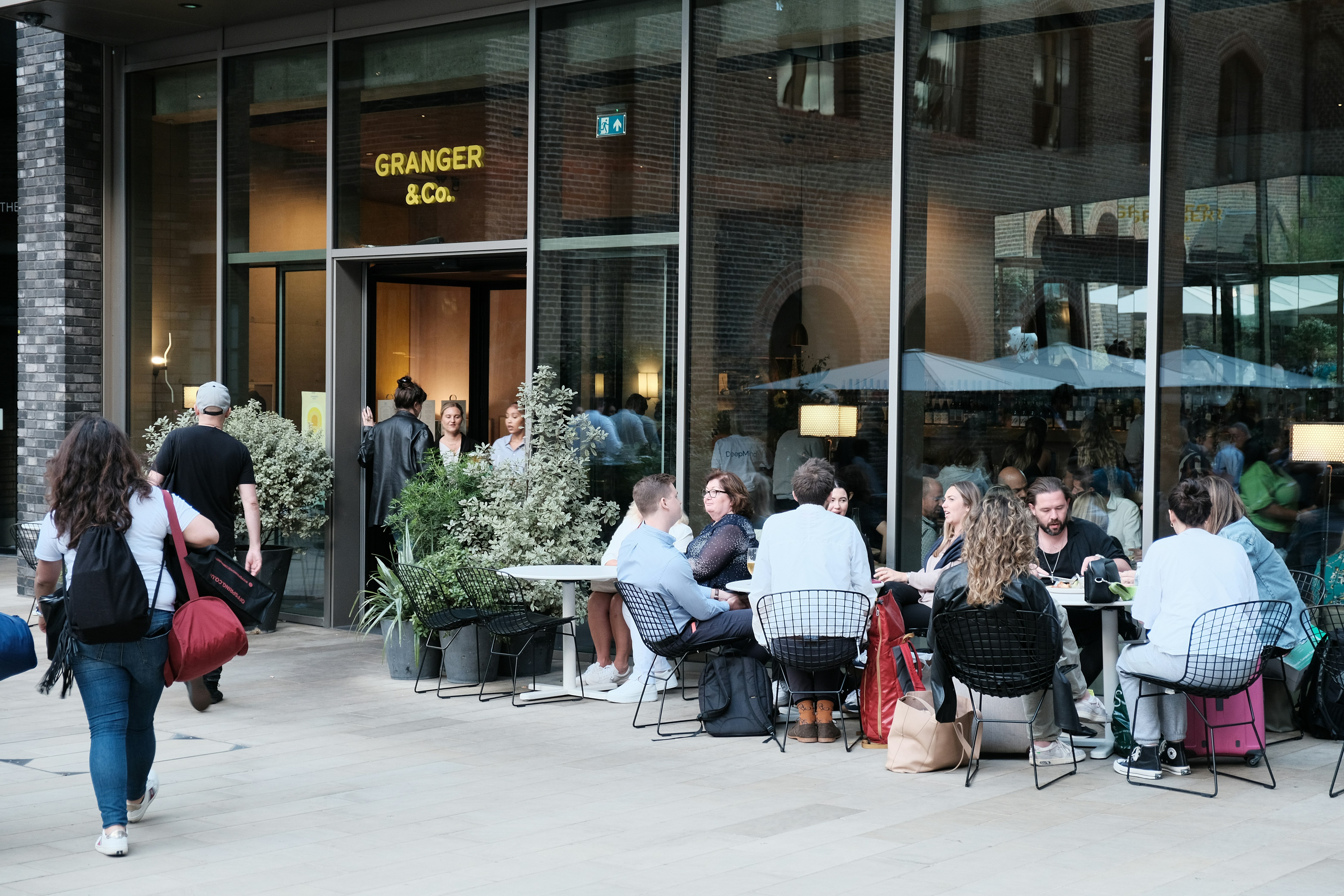 People sitting outside a building photo – Free Grey Image on Unsplash