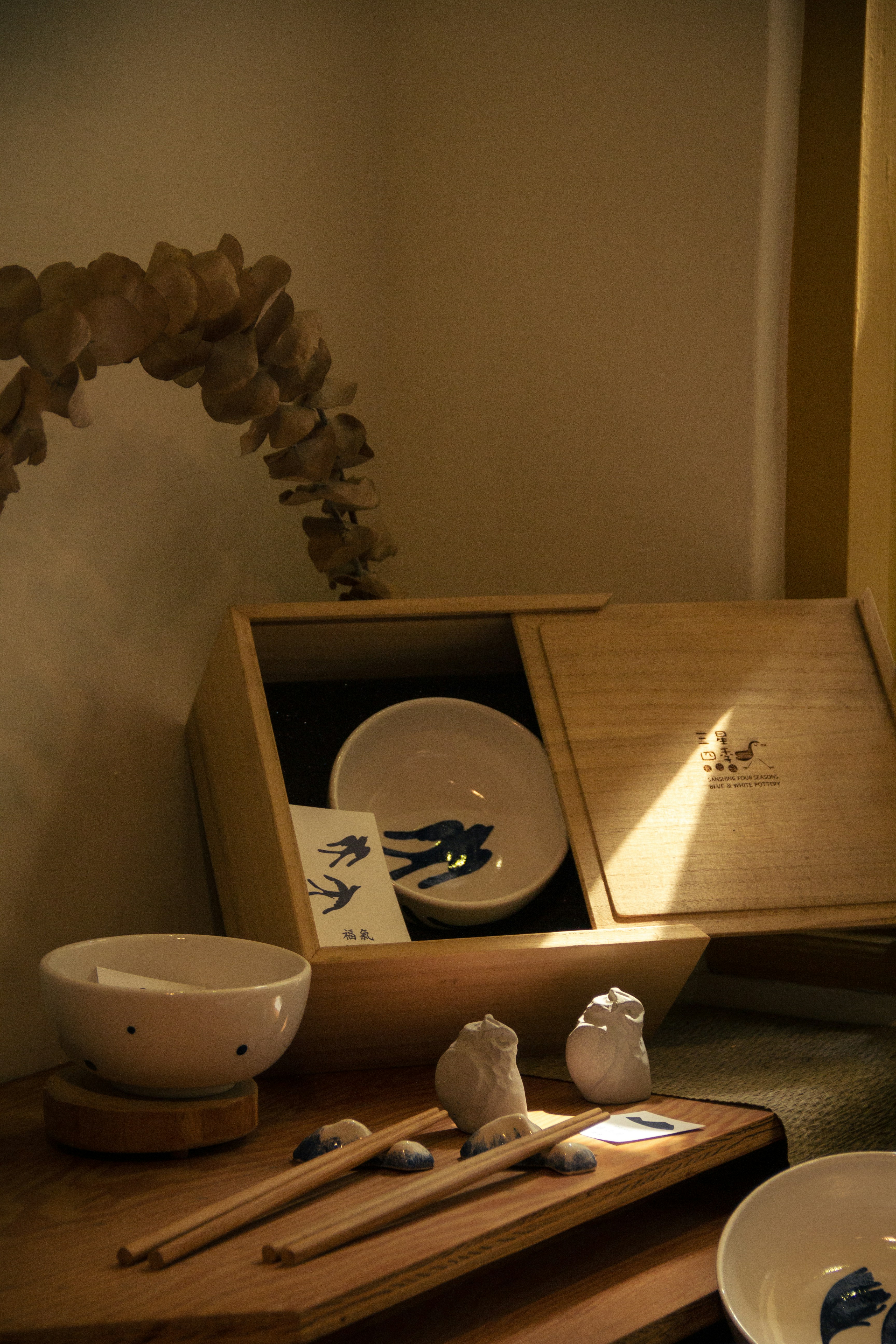 Amber Stillness: Ceramics and Wood Under Velvet Light