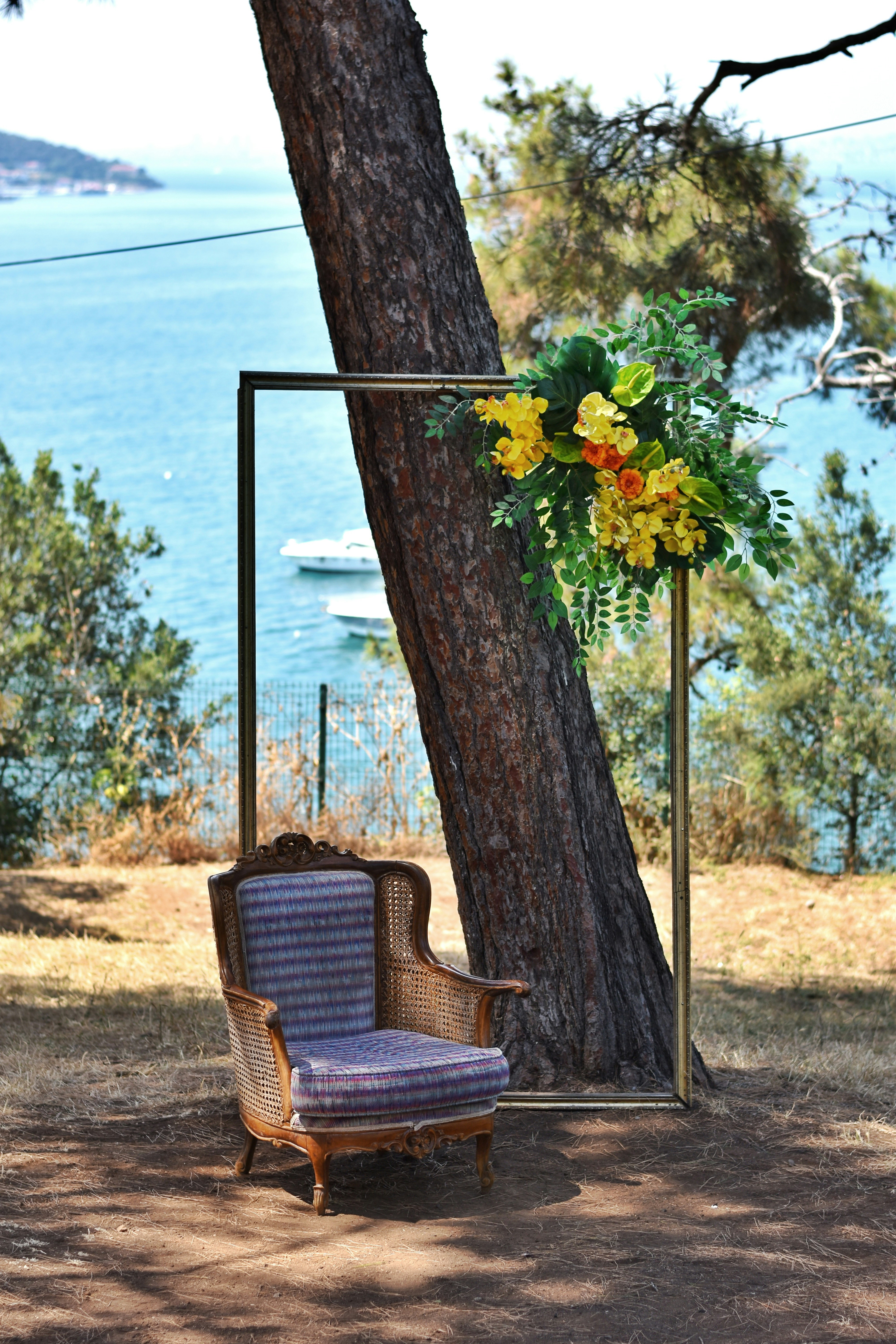 Frame Within a Frame: A Floral Arch Framing a Coastal Chair