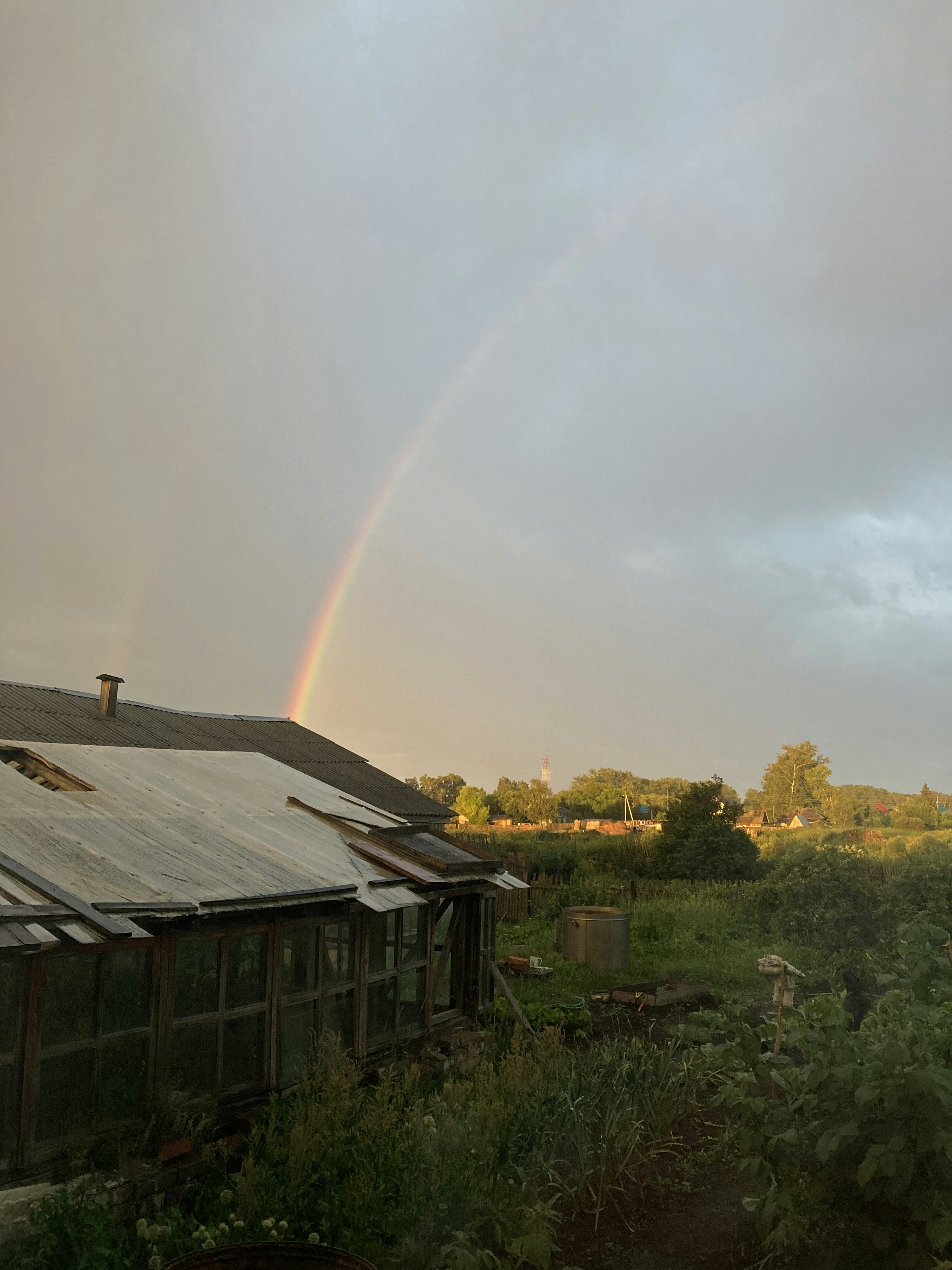 A rainbow over a house photo – Free Building Image on Unsplash