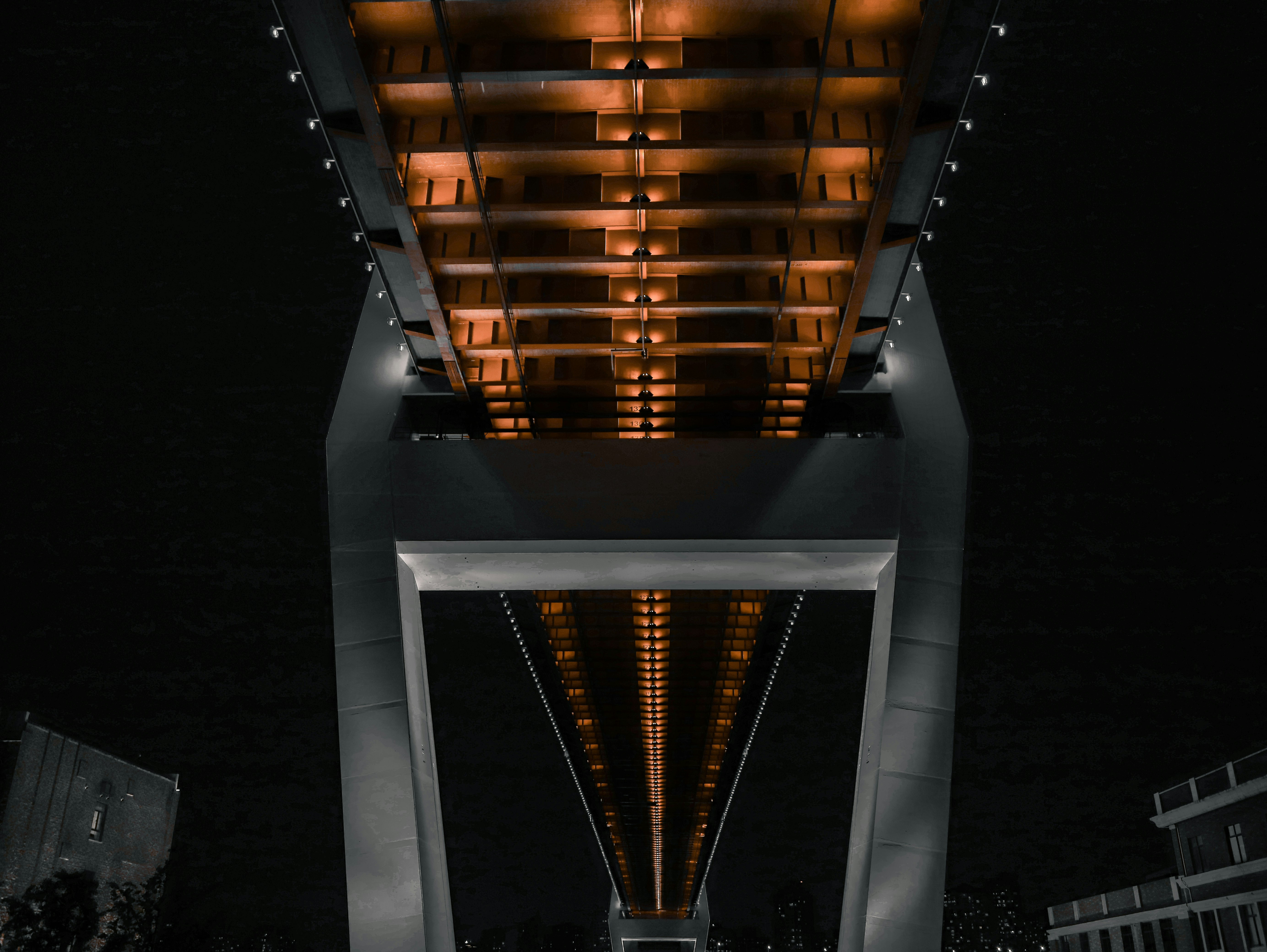 Emberline Underpass: Night-lit Bridge Axis Receding into Darkness