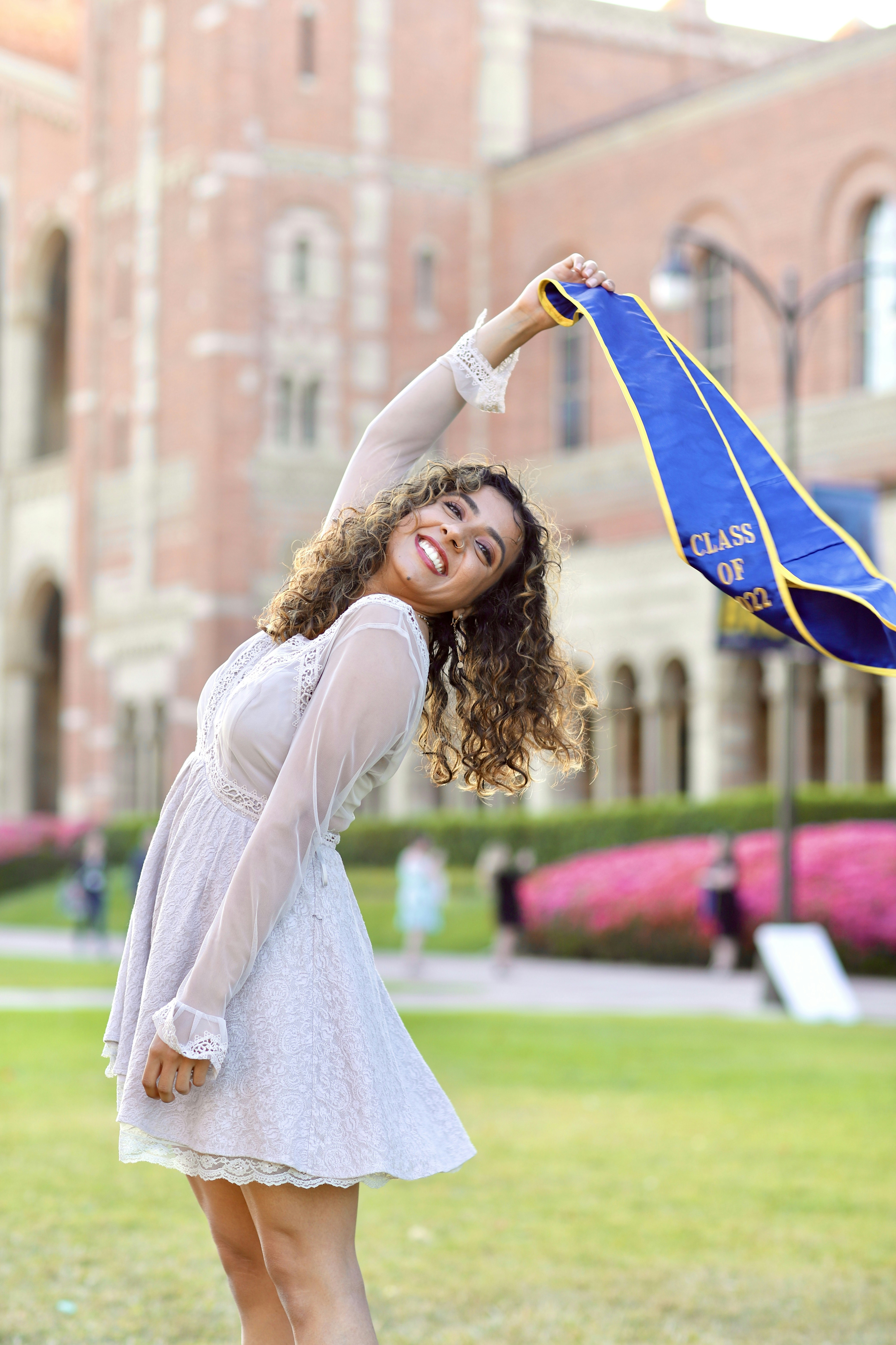A woman holding a kite photo – Free Graduation Image on Unsplash