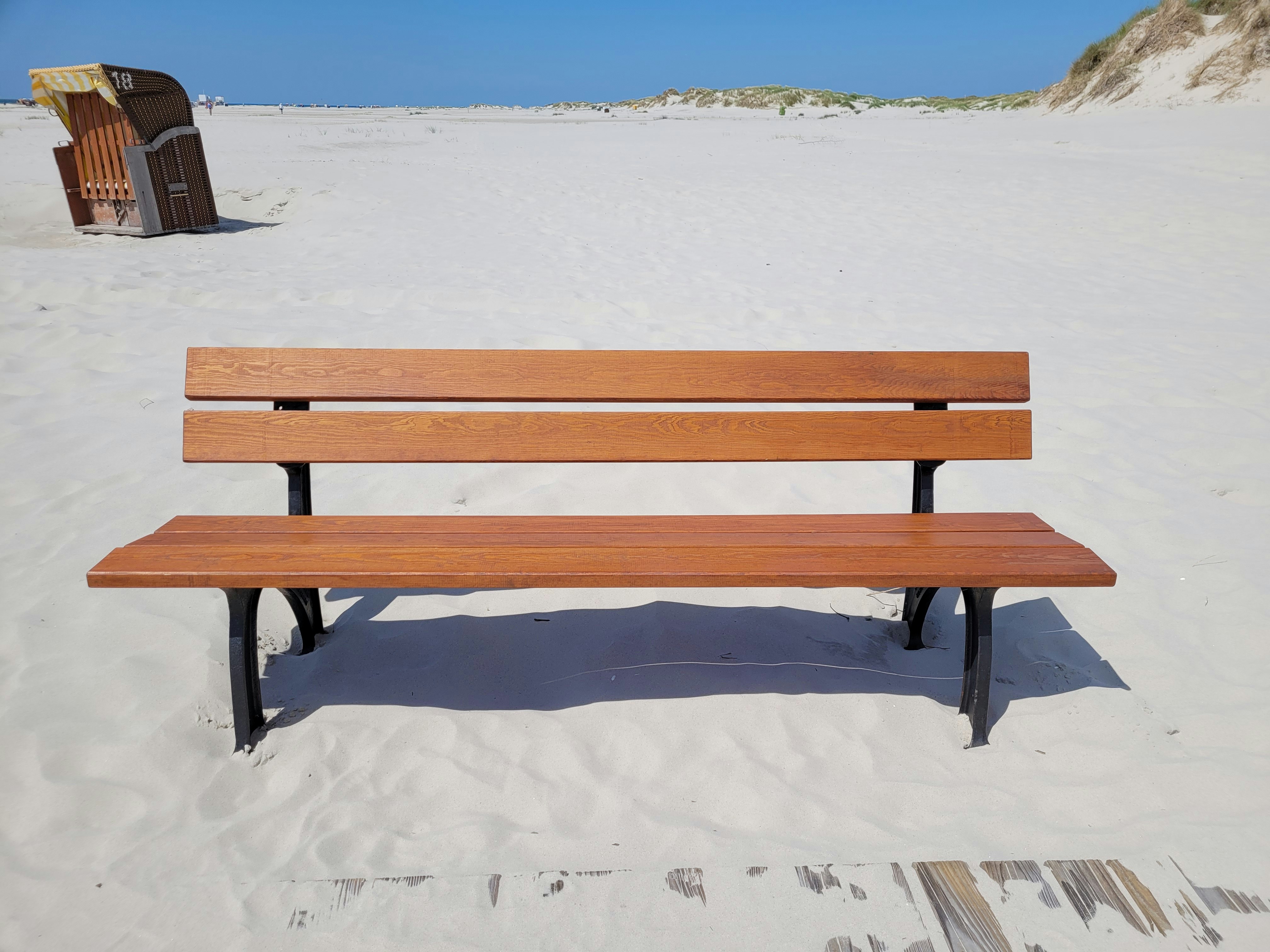 Sun-Warmed Bench on a Wind-Swept Beach