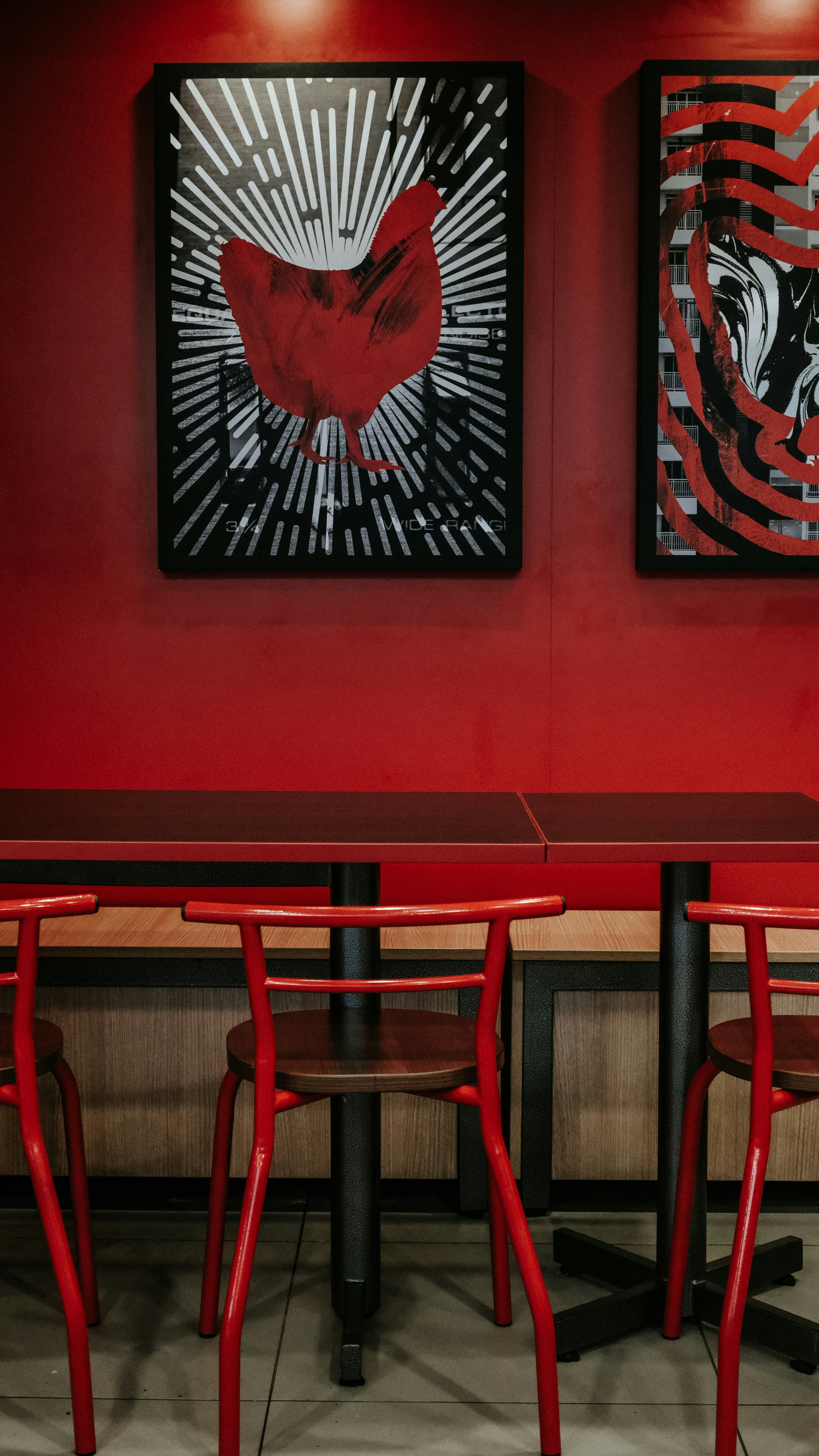 a red table with a black and white drawing on it