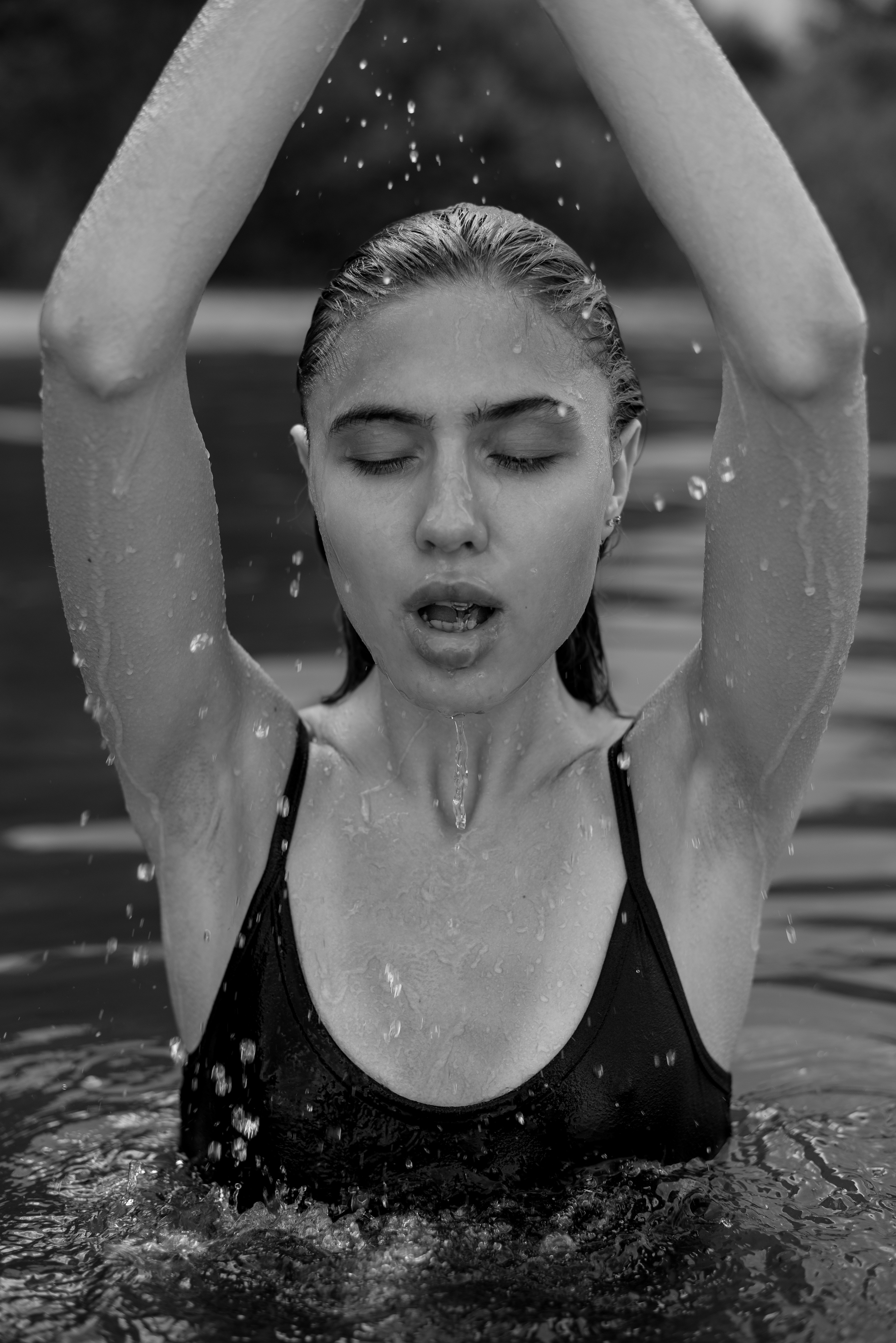 Centered in Water: A Quiet Portrait of Focus with Rising Droplets
