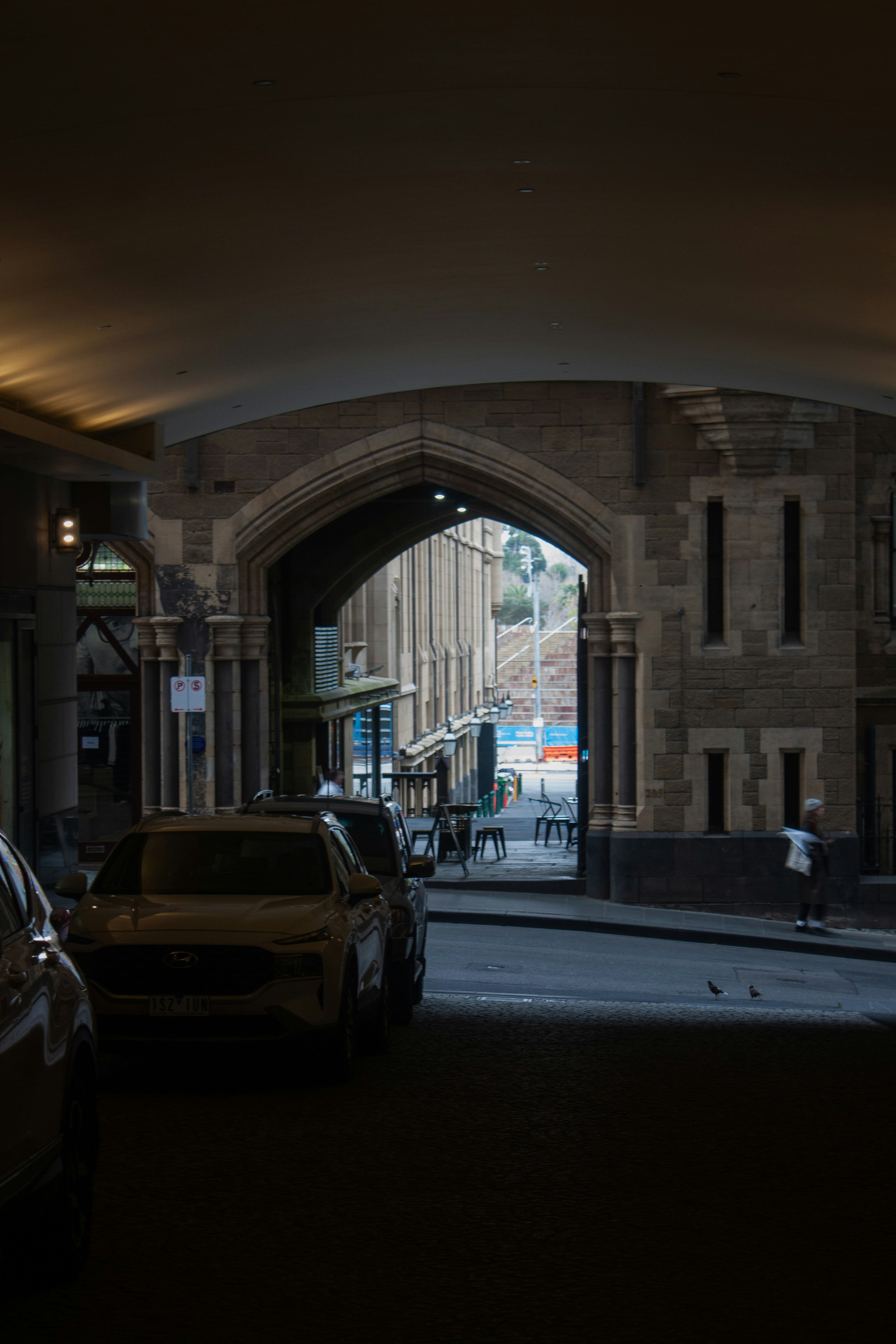 Through the Stone Arch to the Quiet Street