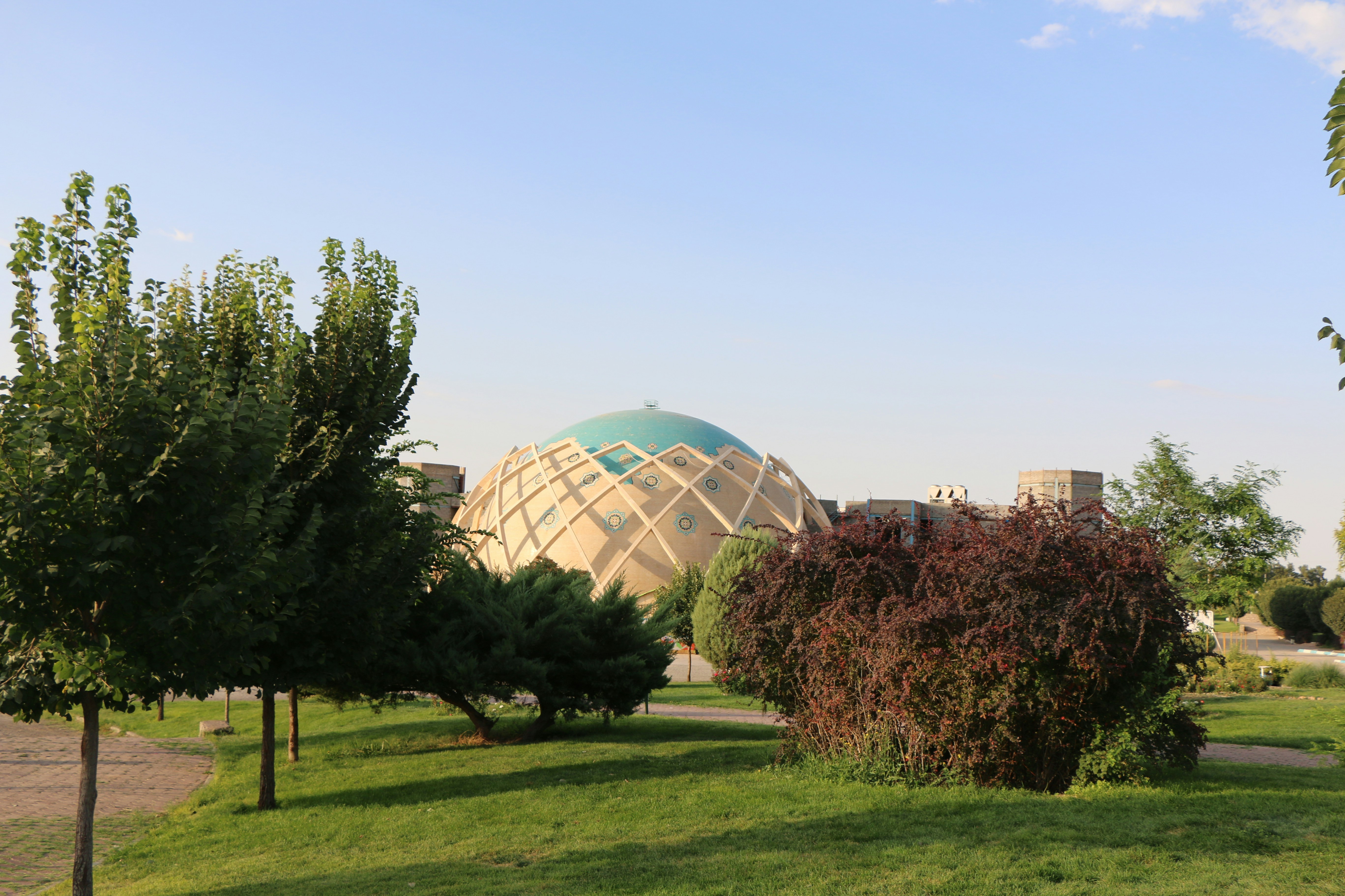 a large sphere shaped building surrounded by treesMohammad Amiri
