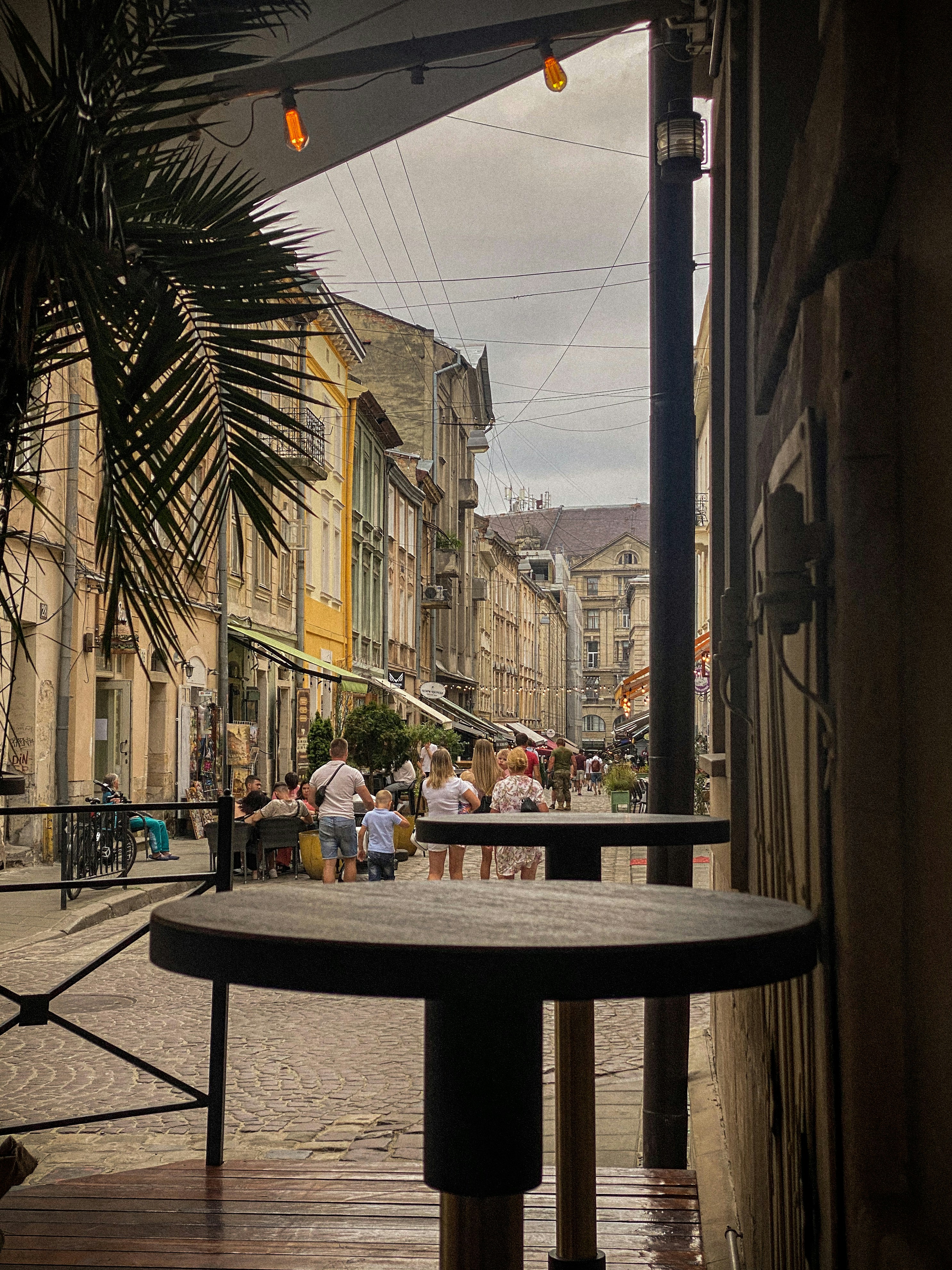 Evening Luminescence on a Cobblestone Street Café