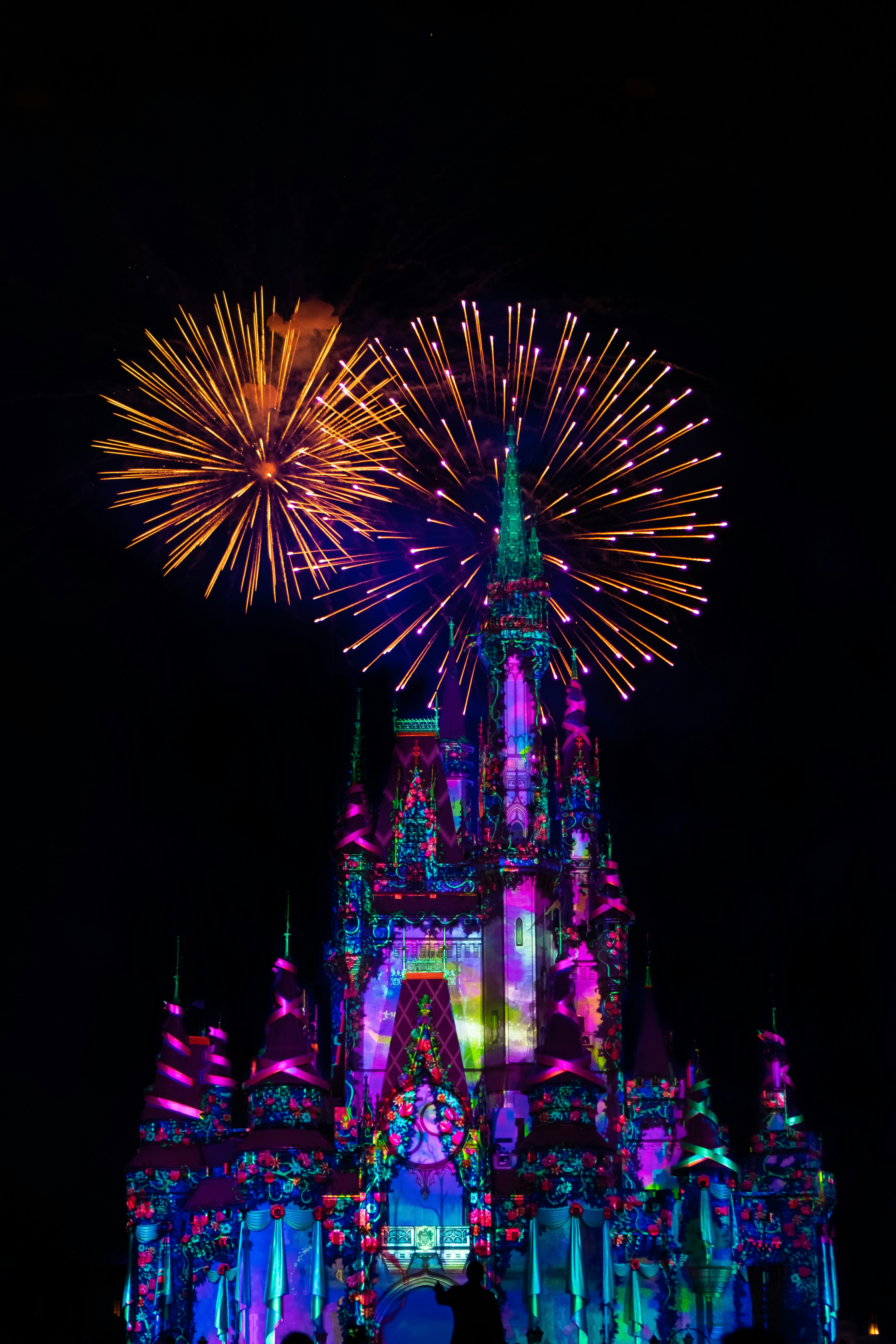 A castle lit up at night with fireworks photo – Free Fireworks Image on ...