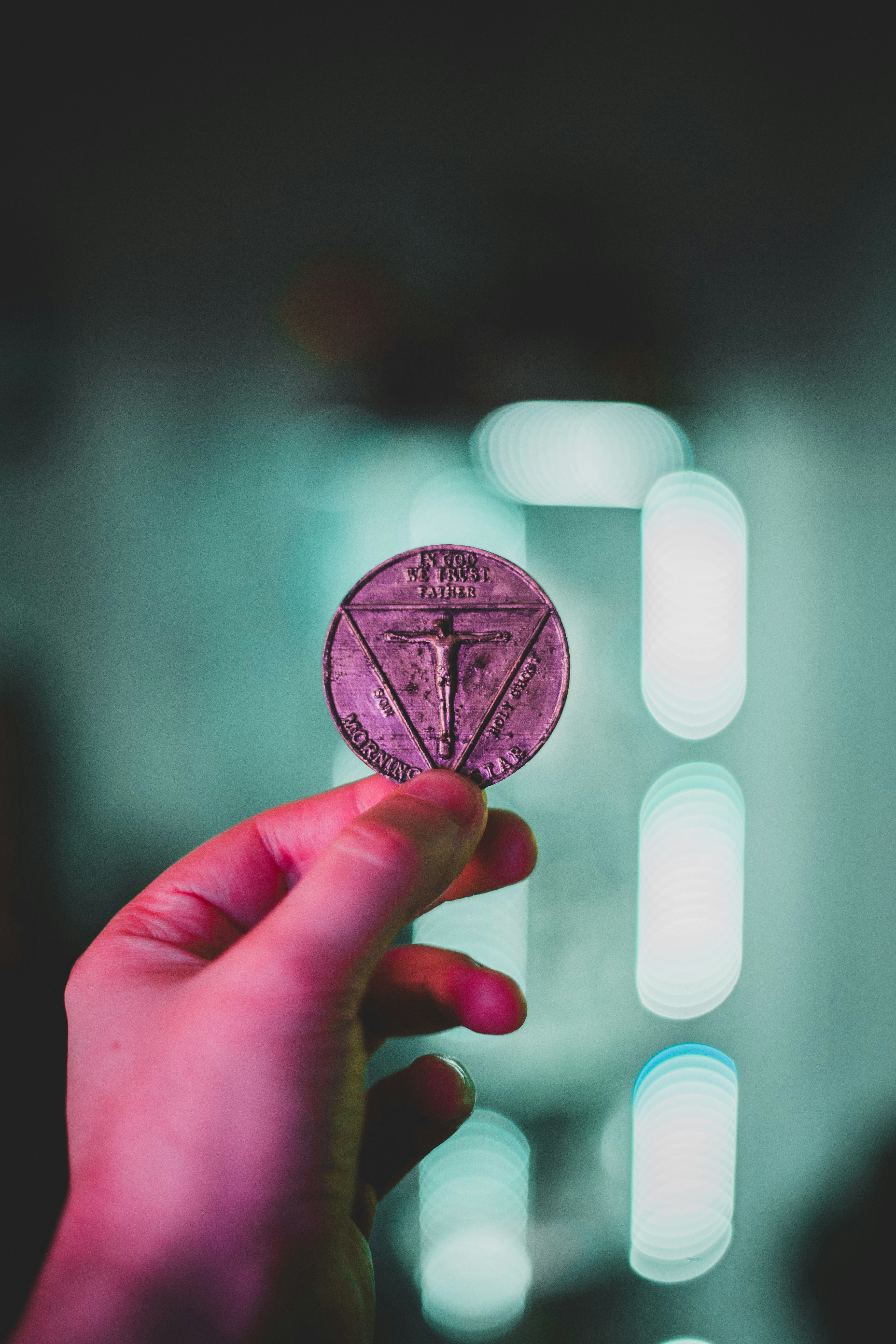 Minted in Neon: A Handful of Digital Coin Held Before Glowing Bars
