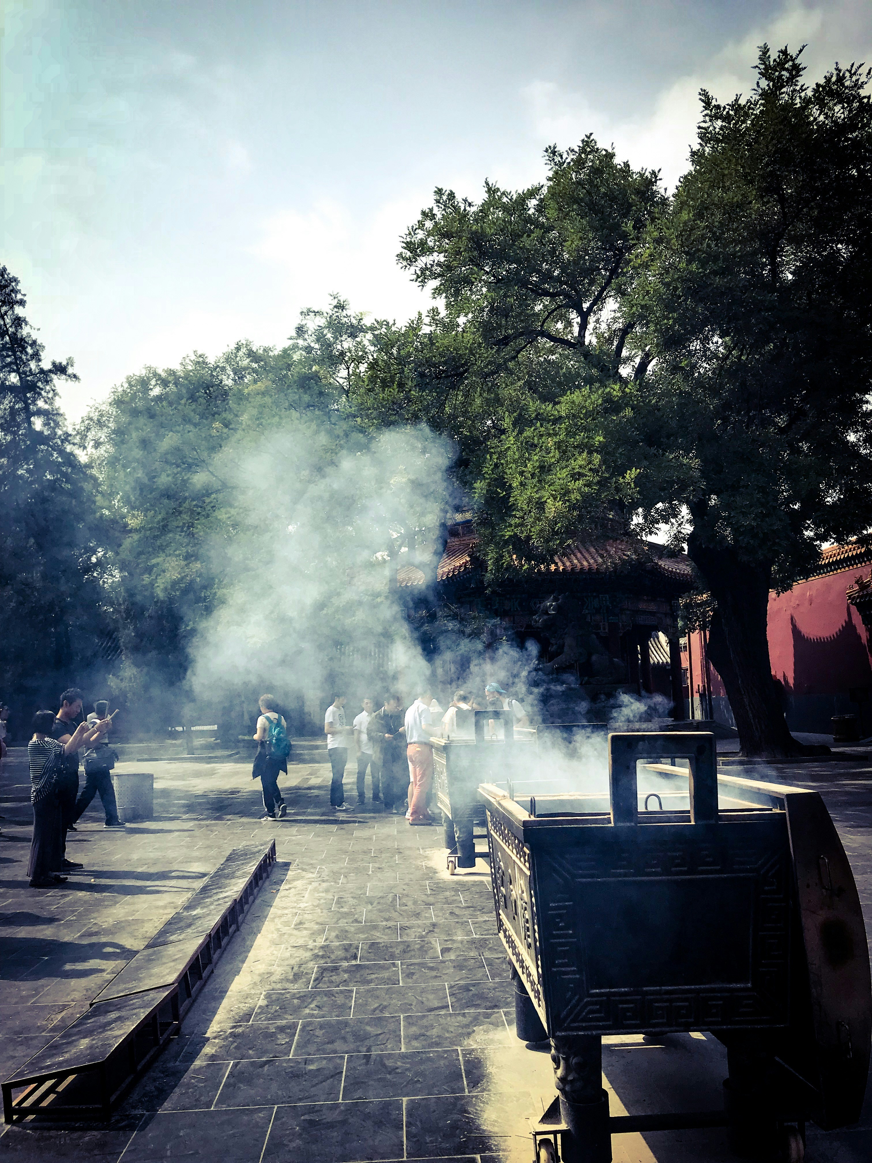 Whispers of Smoke Over a Timeless Temple Courtyard