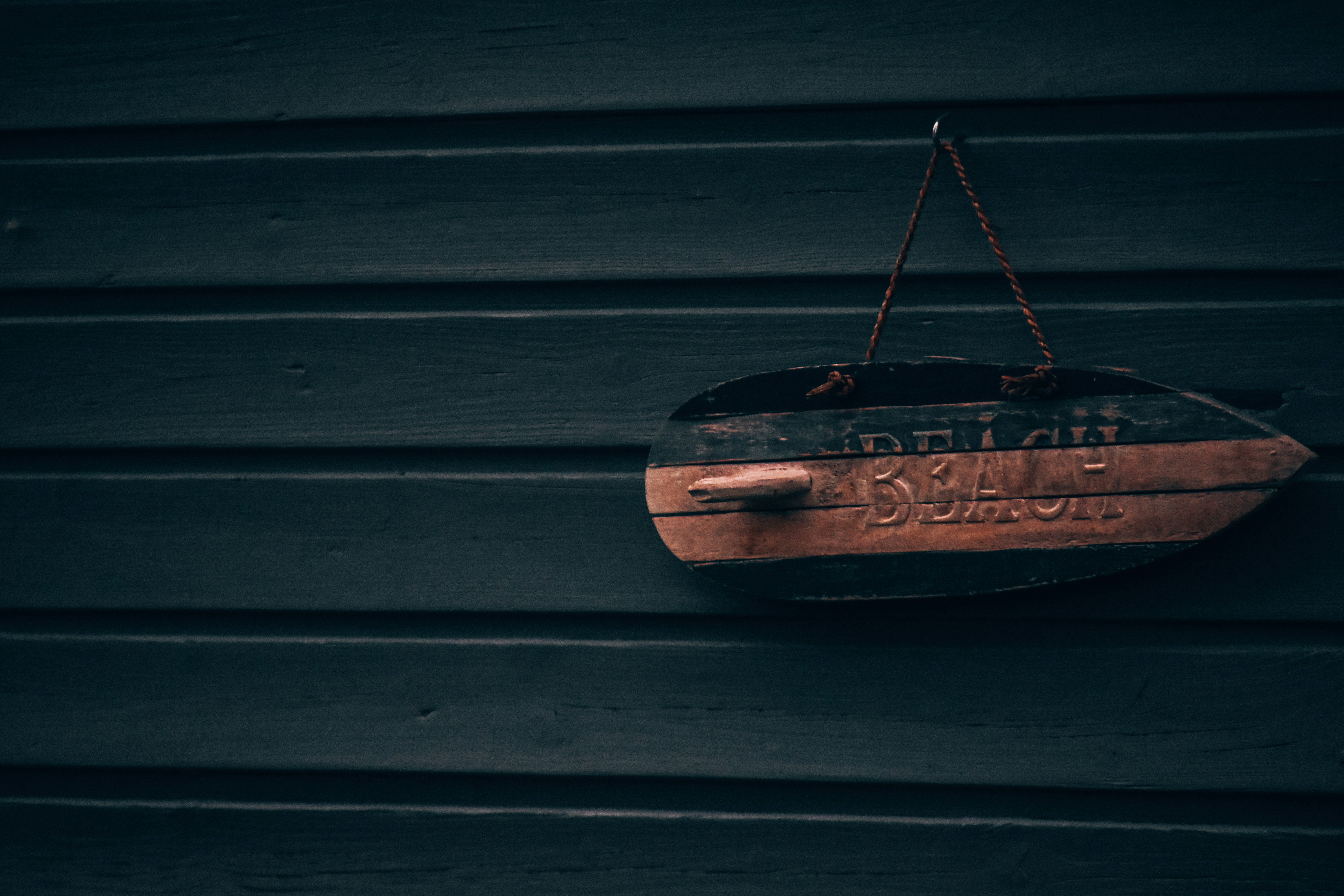 Weathered Sign on a Slate-Blue Shed