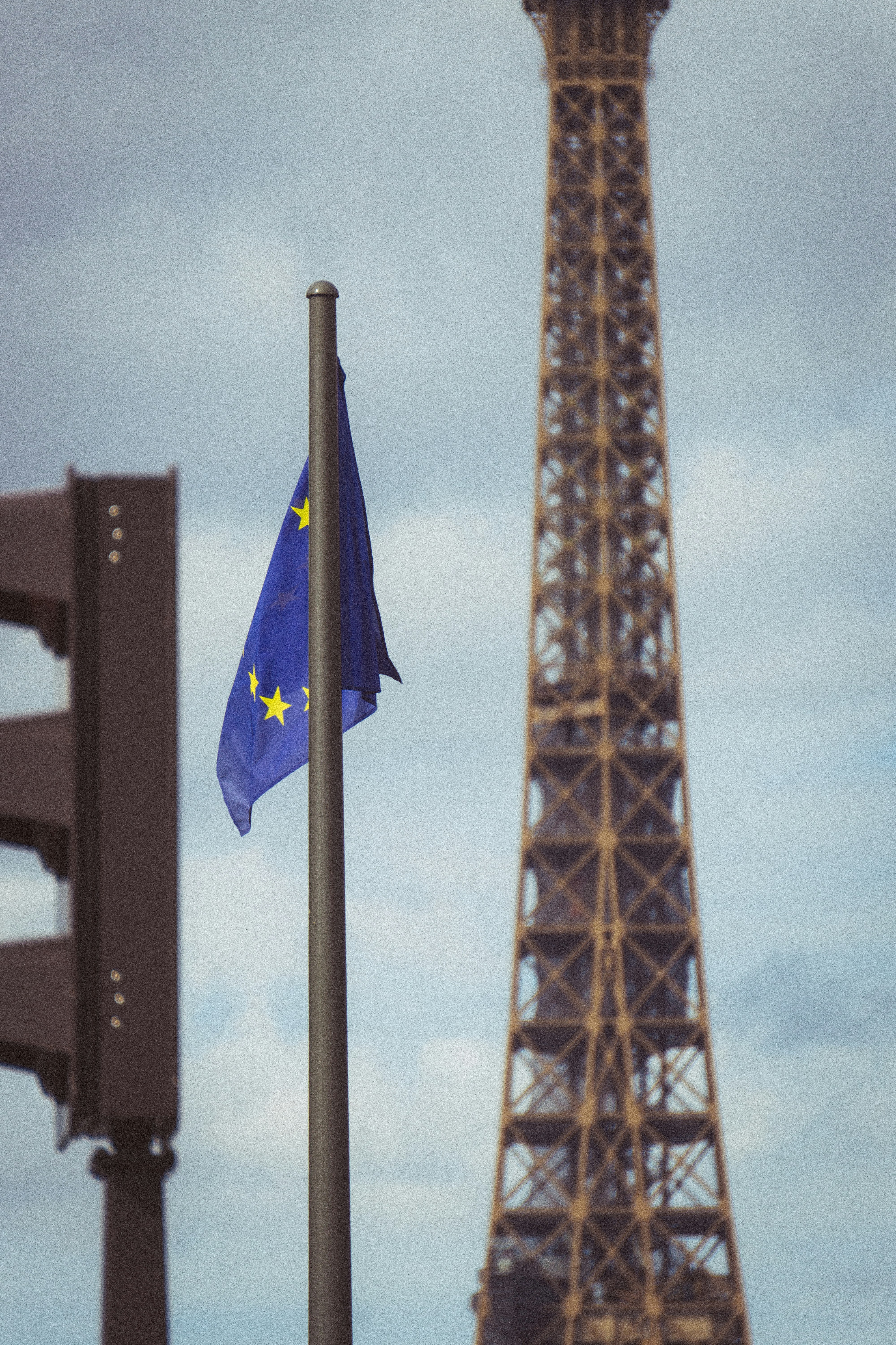 A tall metal tower with a flag photo – Free Paris Image on Unsplash
