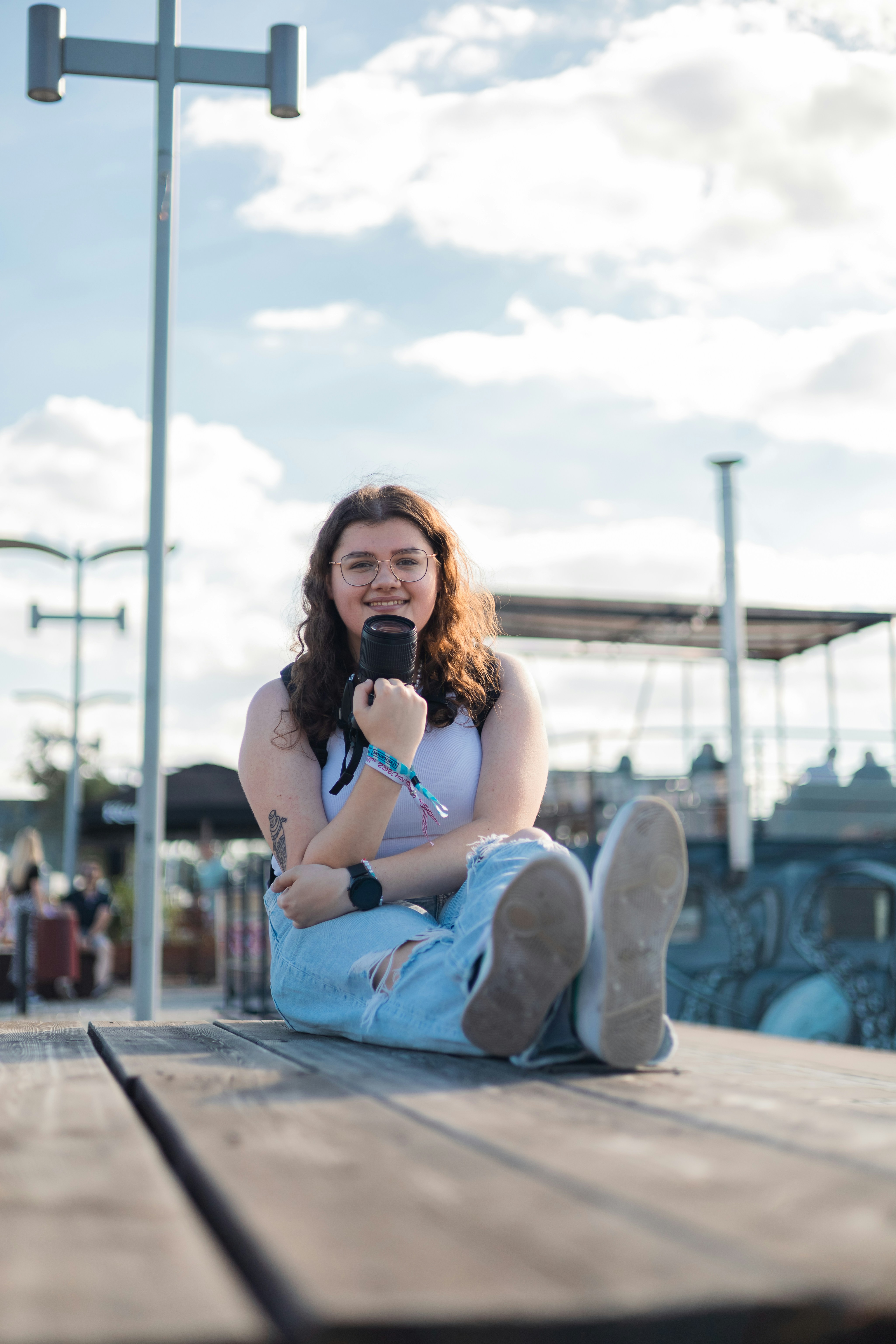 A person sitting on a dock photo – Free 35 mm Image on Unsplash