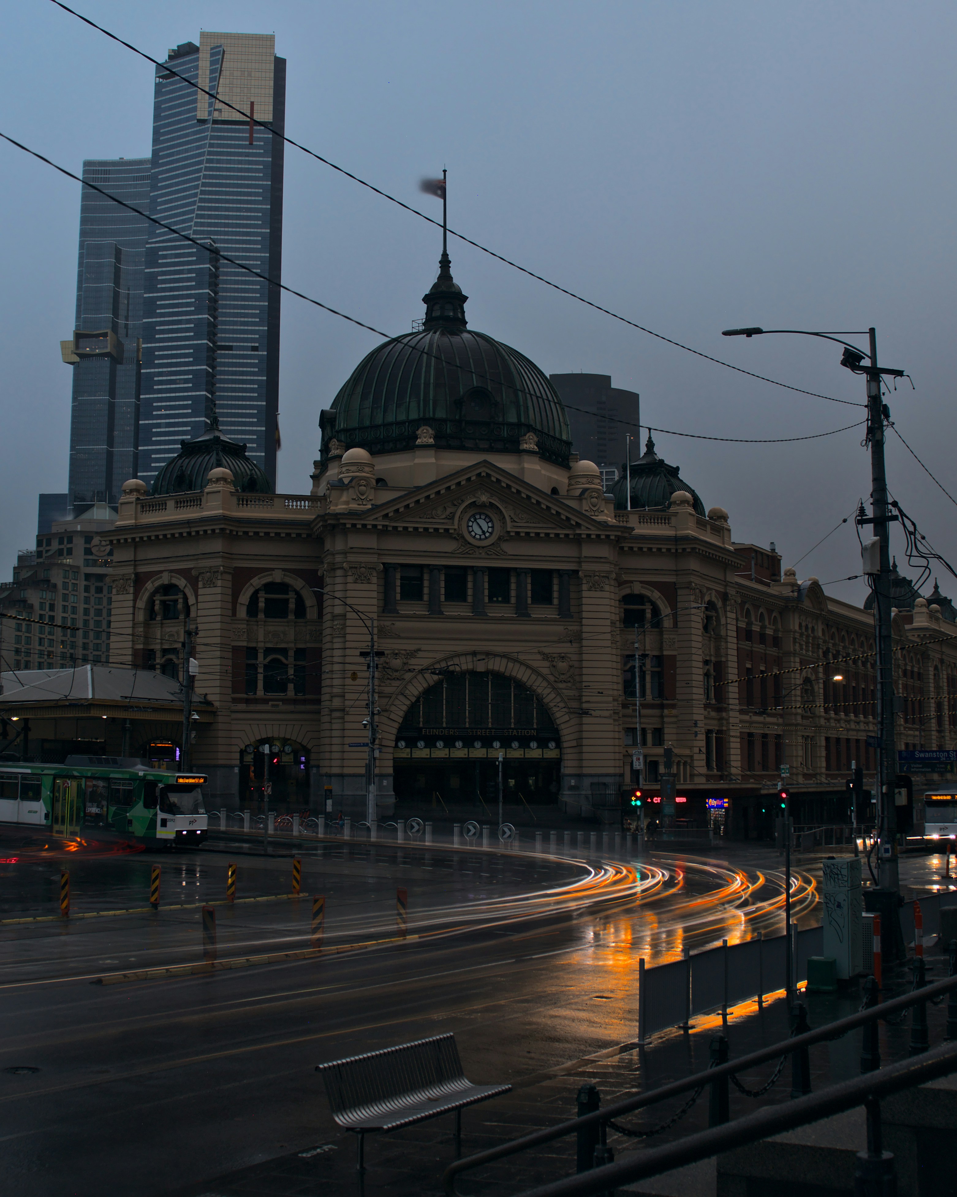 Dusk Confluence: Melbourne's Dome, Trams, and Light Trails