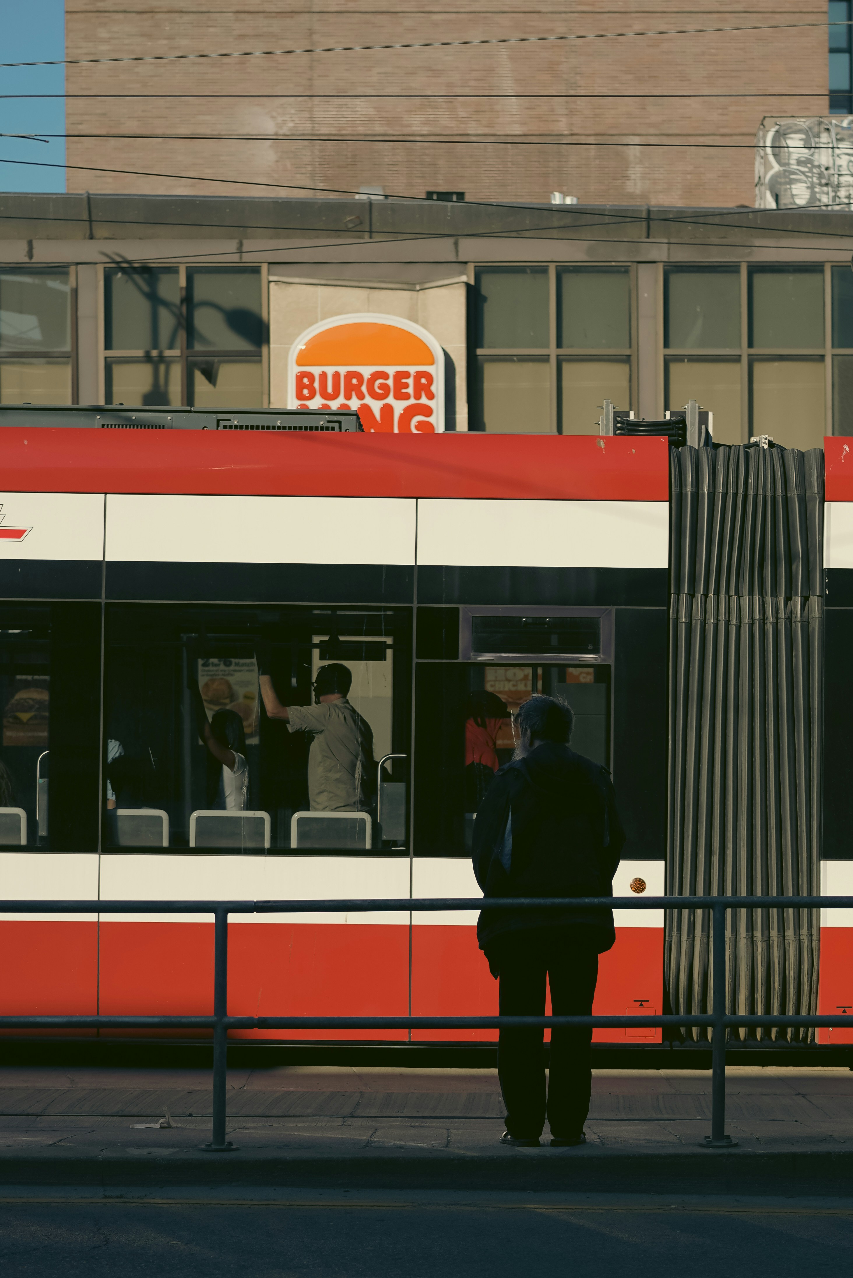 a person standing in front of a restaurant
