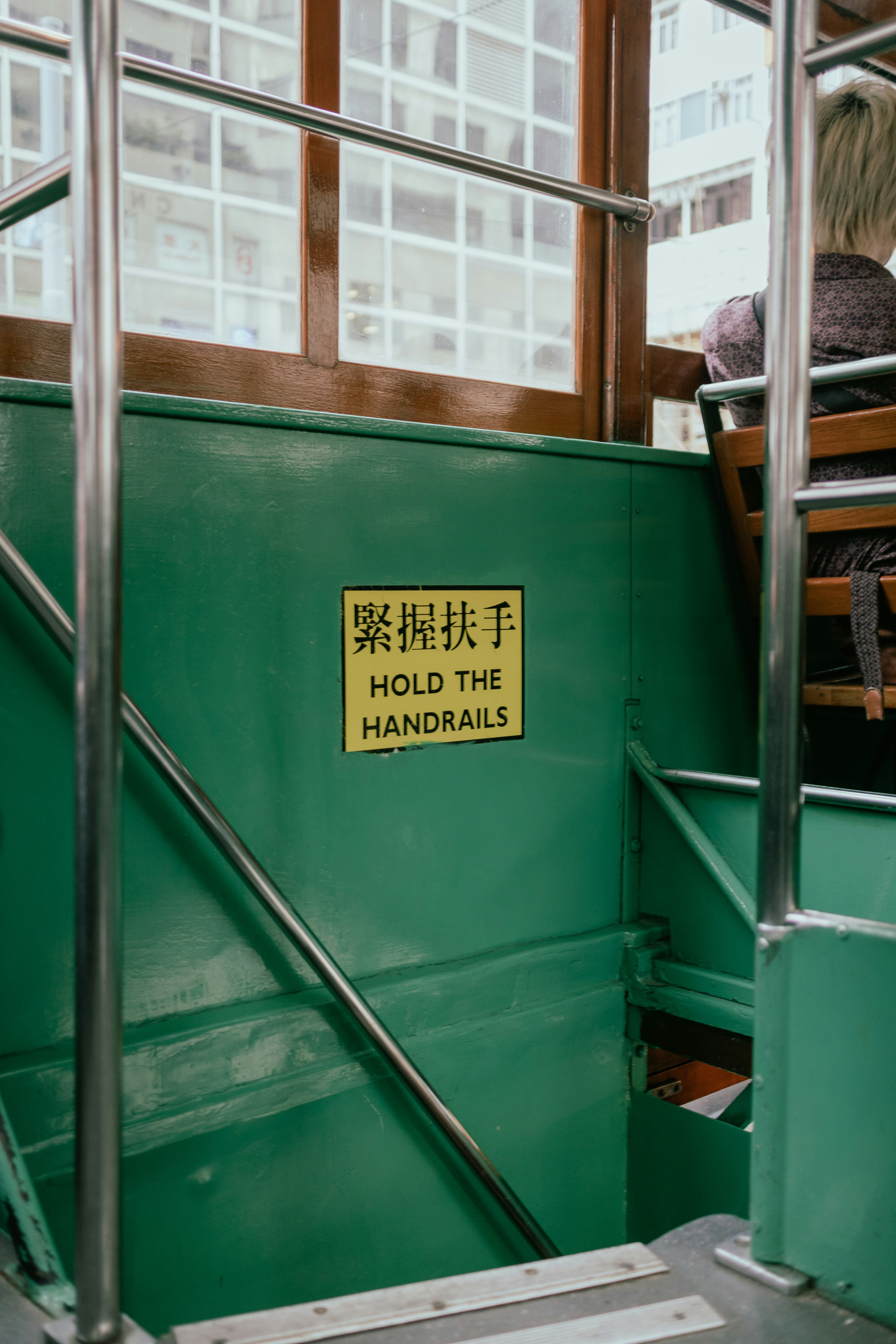 a sign on a green train