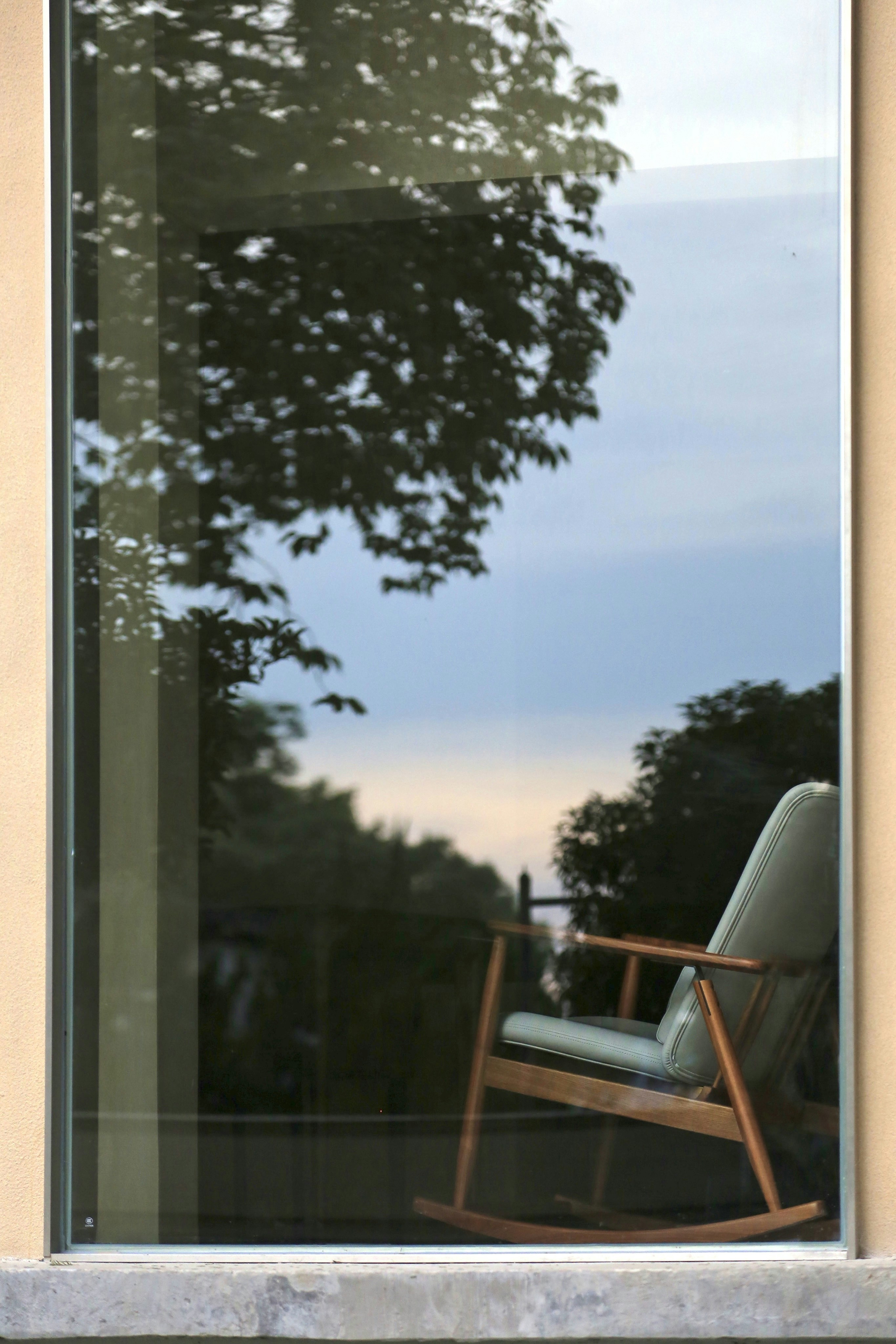 A chair and a window photo – Free Blue Image on Unsplash