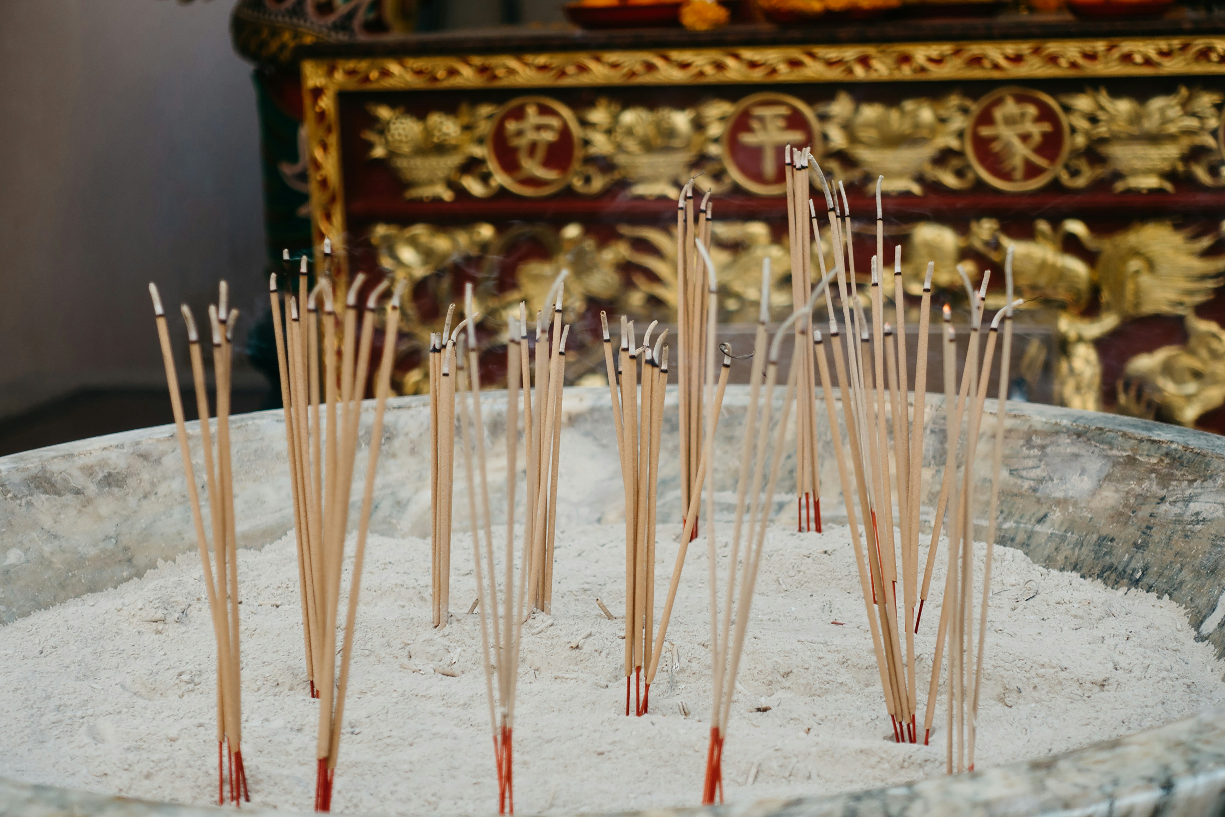 A group of sticks with sticks in front of a sign photo – Free Bangkok ...