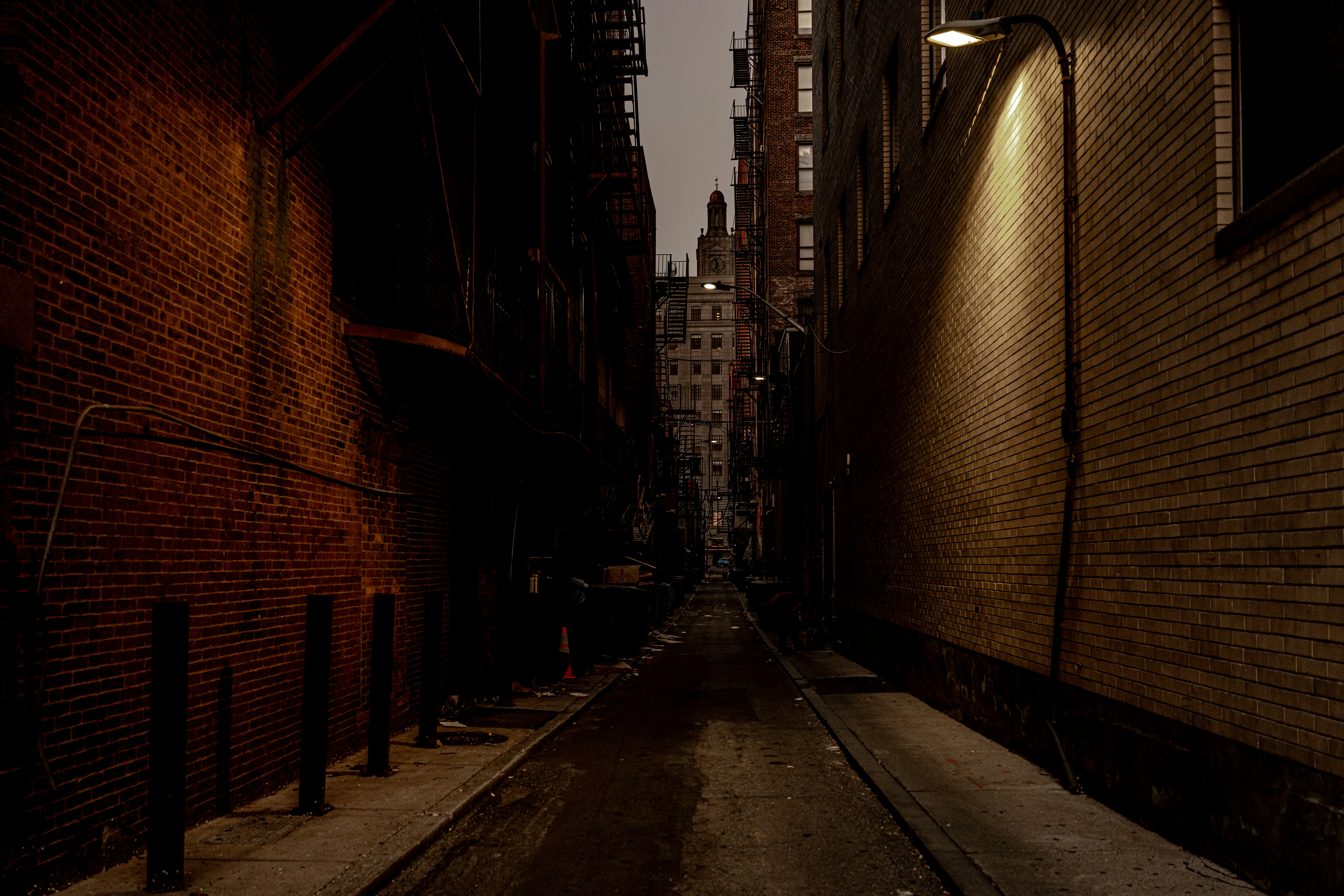a street between brick buildings