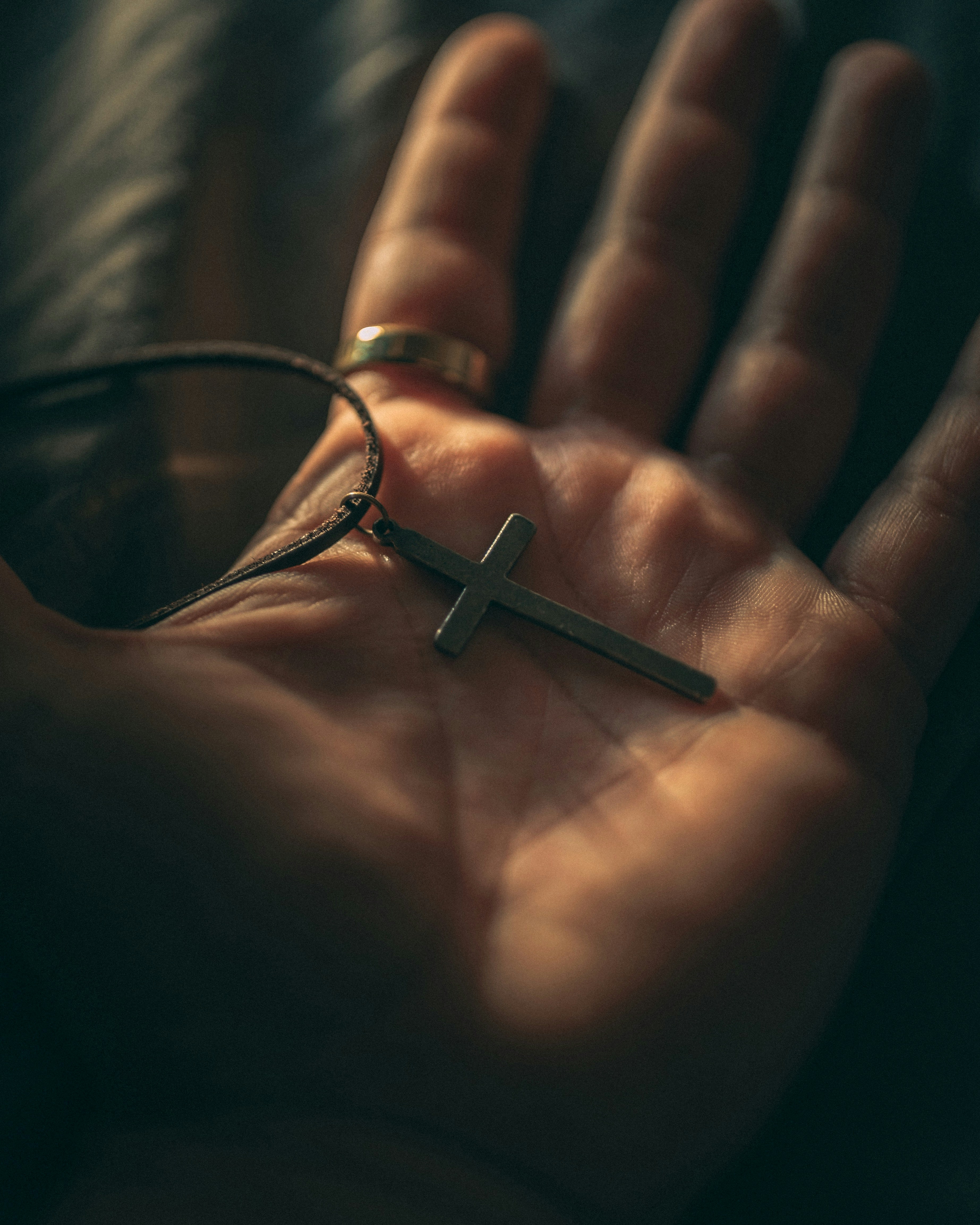 Cross on the Palm: Warm Light and Quiet Detail